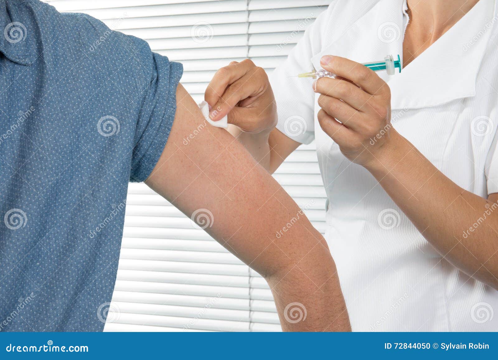 Man is Getting an Injection with a Syringe at Clinic Stock Photo ...