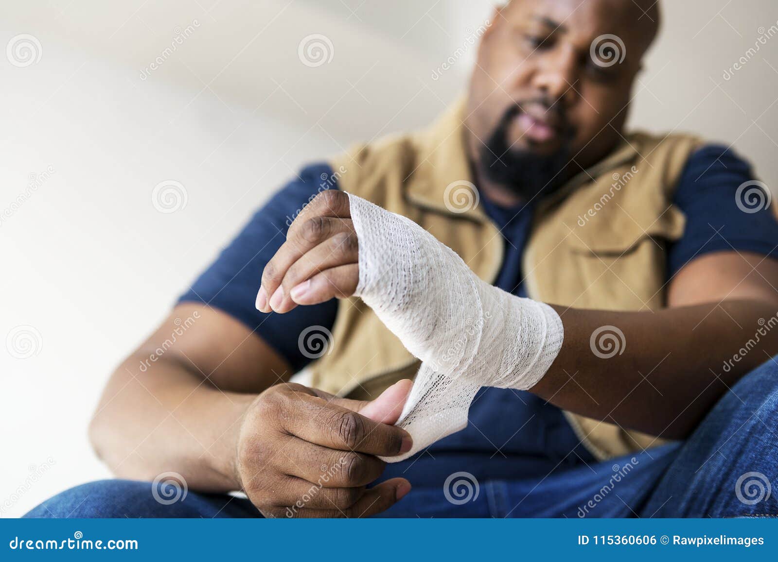 A Man Getting Injured Putting on Bandages Stock Photo - Image of ...
