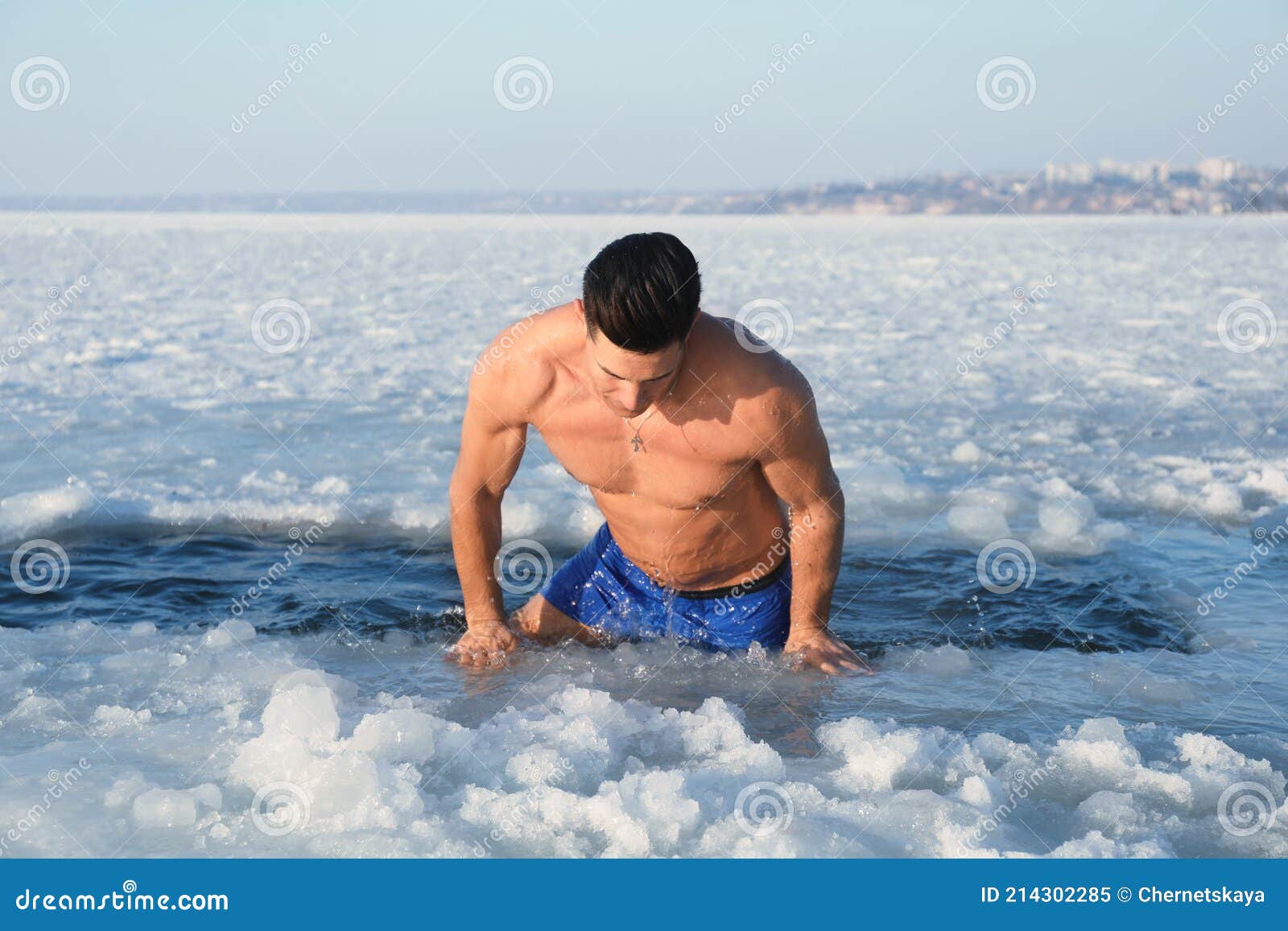 Man Getting Out of Ice Hole on Winter Day. Baptism Ritual Stock Image ...