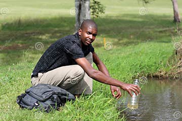 Man getting water stock photo. Image of african, camping - 5101320