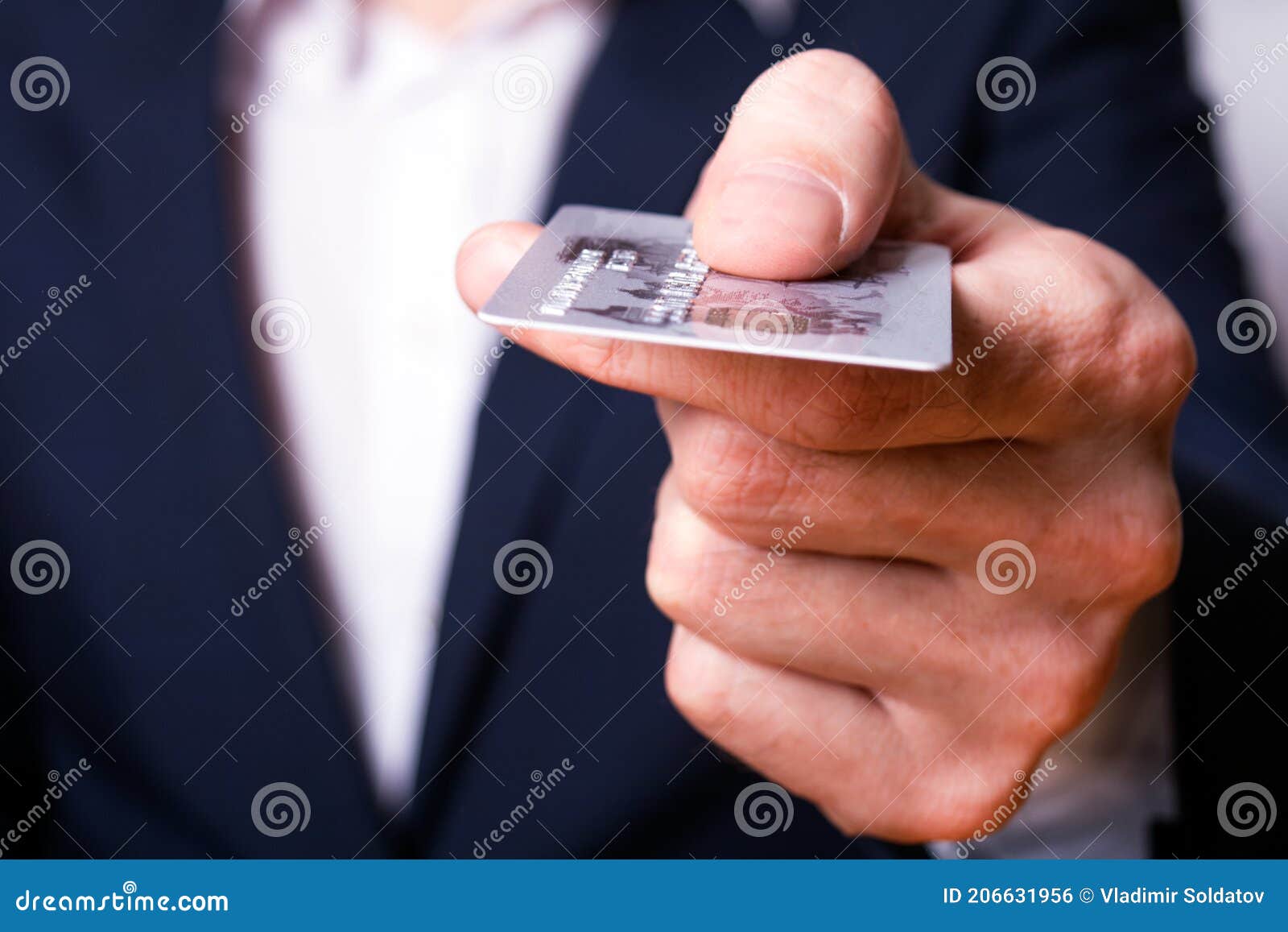 Man gives credit card stock photo. Image of business - 206631956