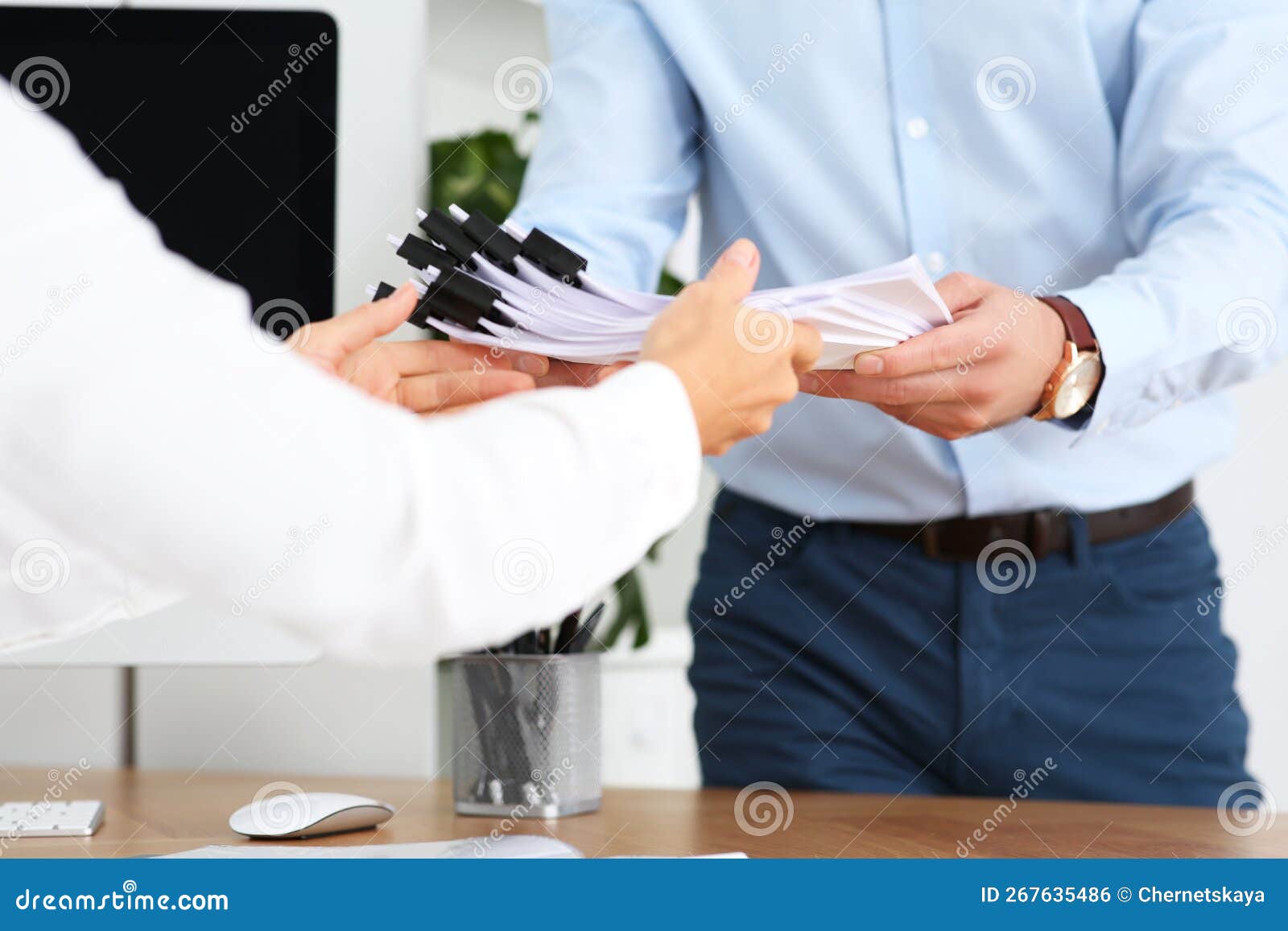 Man Giving Documents To Colleague in Office, Closeup Stock Photo ...