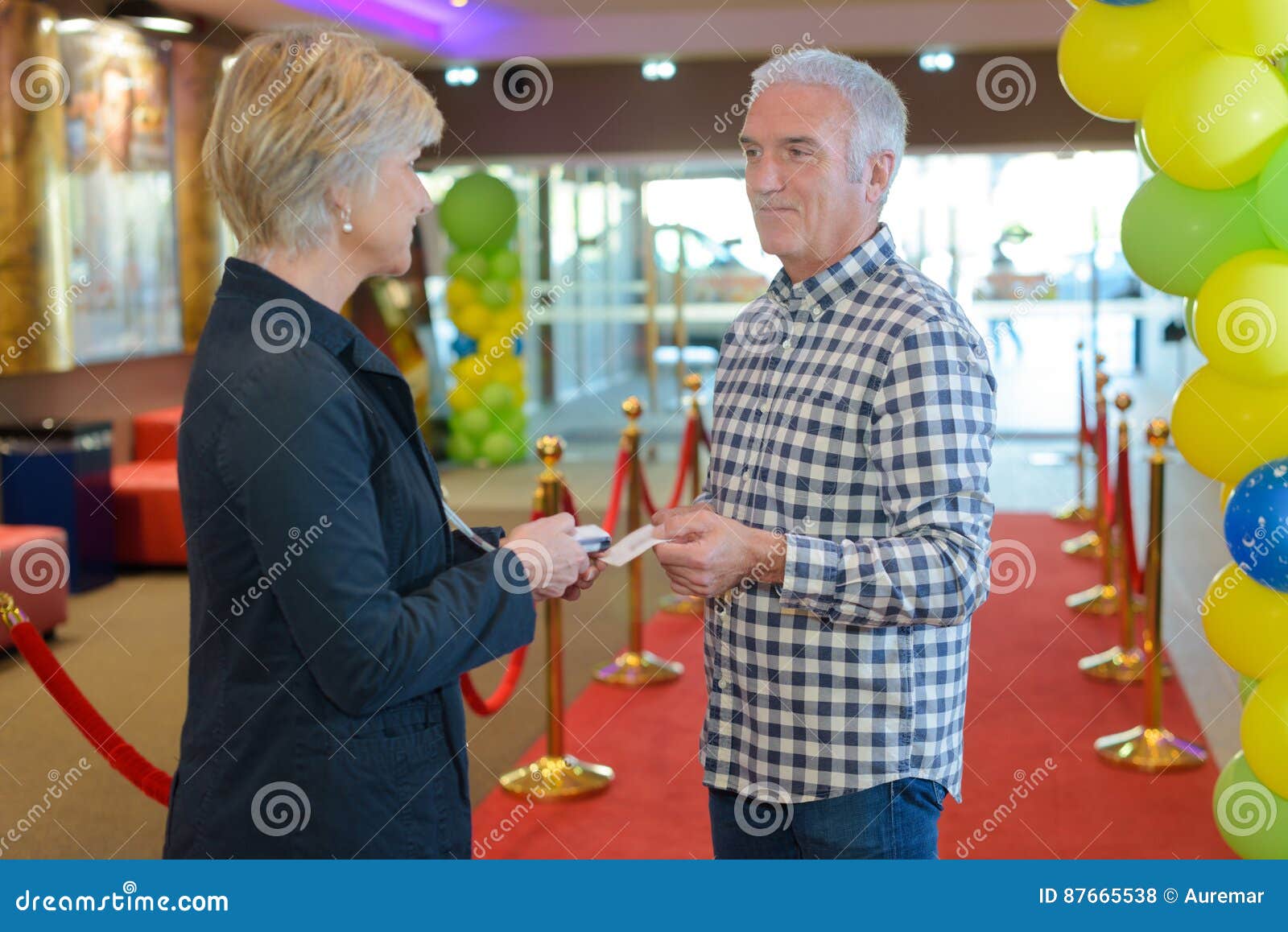 Man giving entrance ticket stock photo. Image of entertainment - 87665538