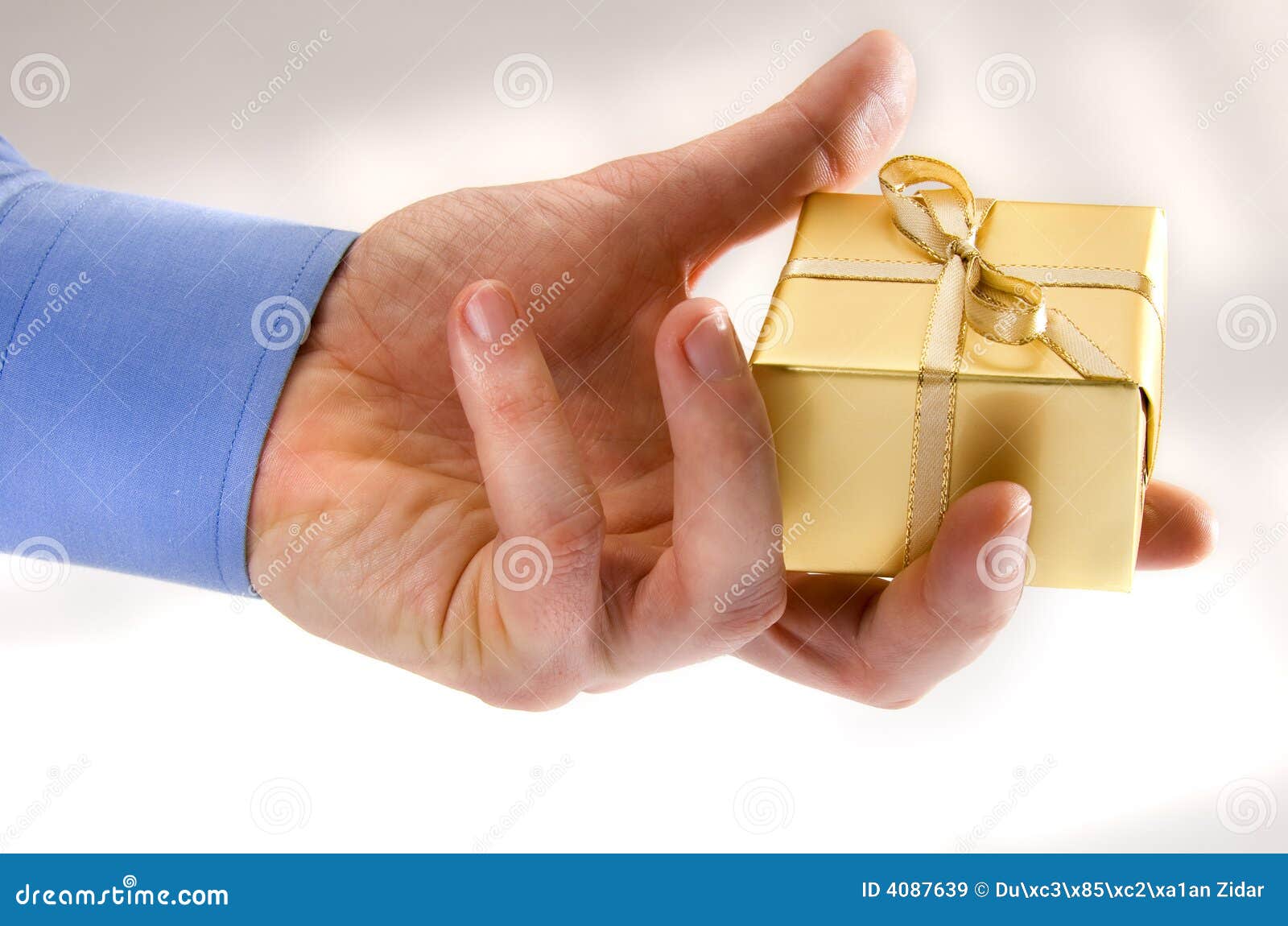 Man Giving a Gold Gift stock image. Image of presenting - 4087639