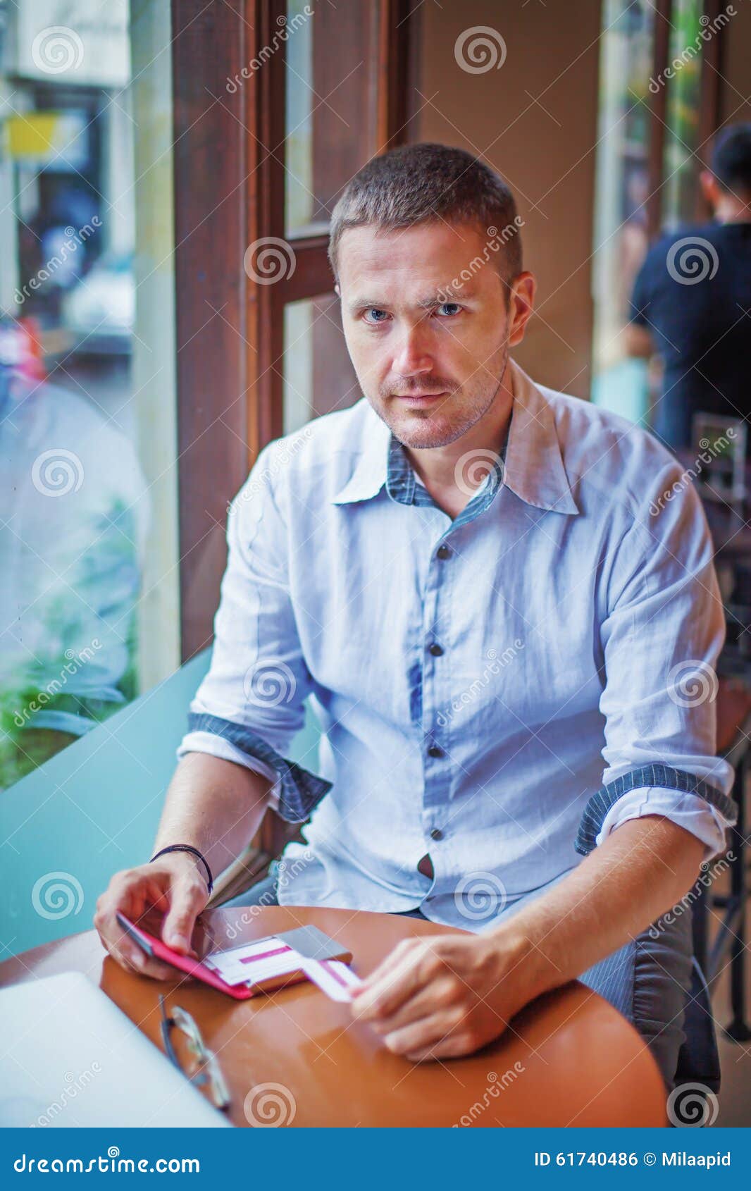 Man Giving His Name Card in Cafe Stock Photo - Image of handsome ...