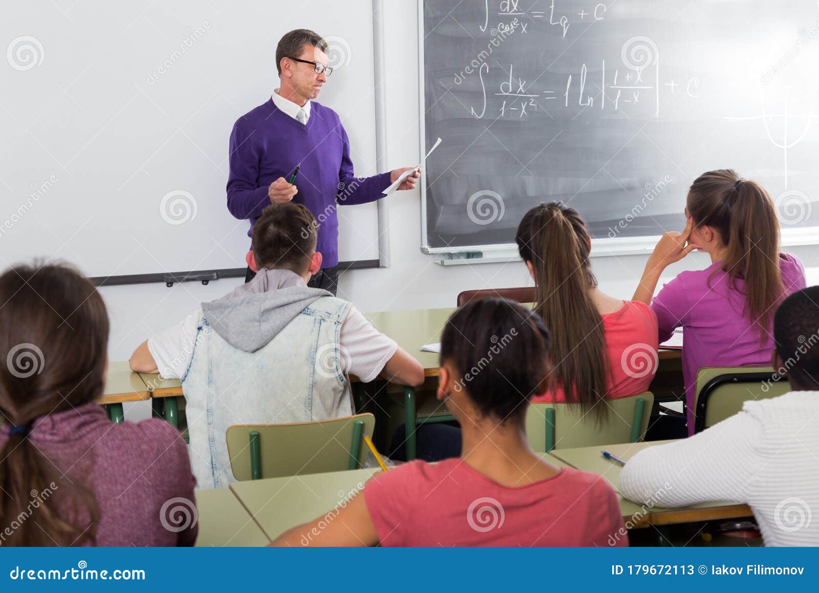 Man giving a math lesson stock image. Image of class - 179672113