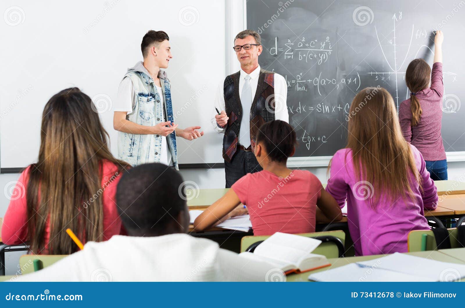 Man giving a math lesson stock photo. Image of diligence - 73412678
