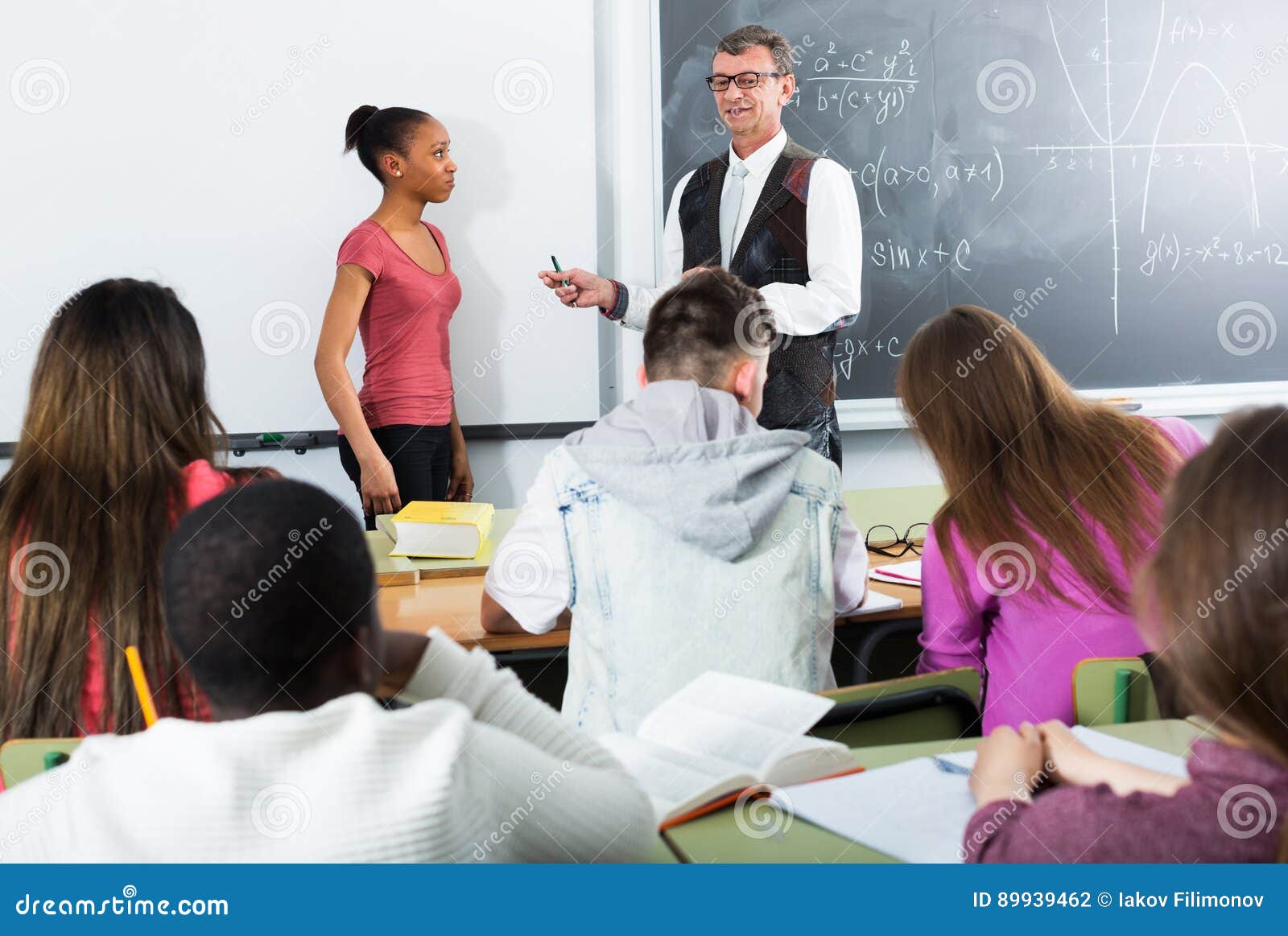 Man giving a math lesson stock photo. Image of group - 89939462