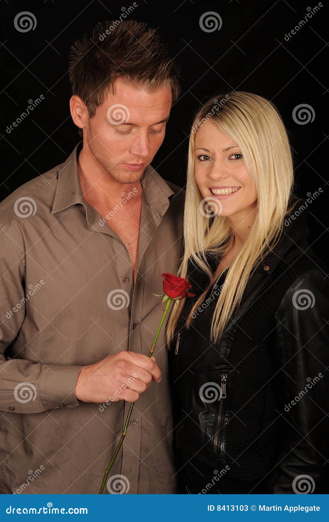 Man giving rose to woman stock image. Image of brunette - 8413103