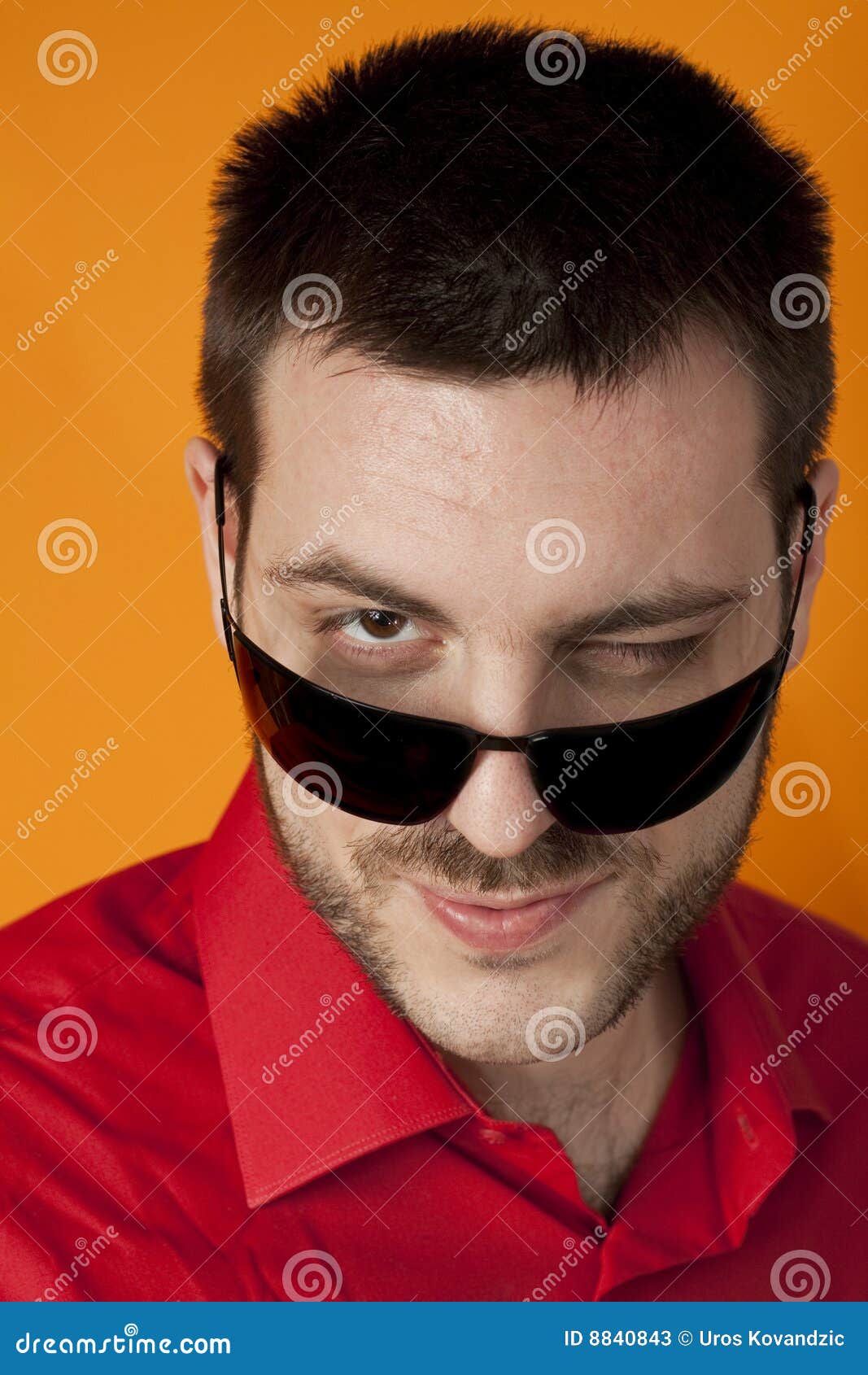 Man Giving a Wink Over Sunglasses Stock Image - Image of focus, shirt ...