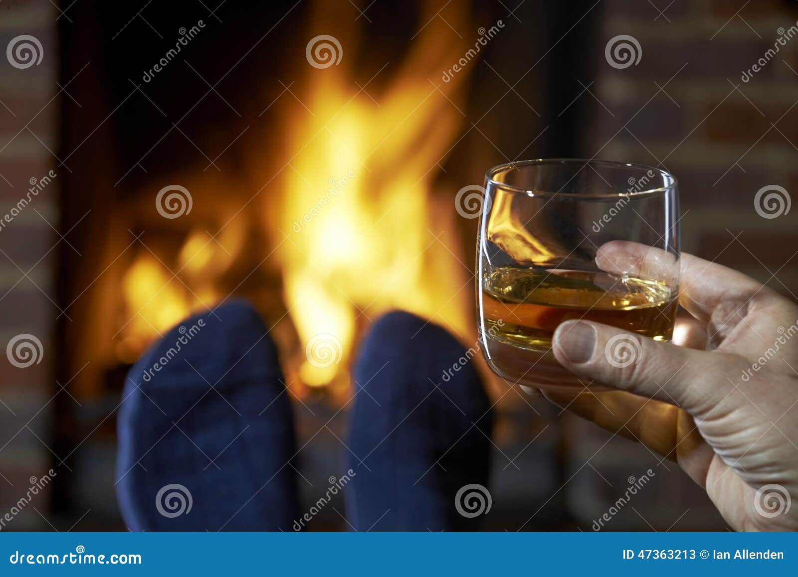 Man with Glass of Whisky Relaxing by Fire Stock Image - Image of flame ...