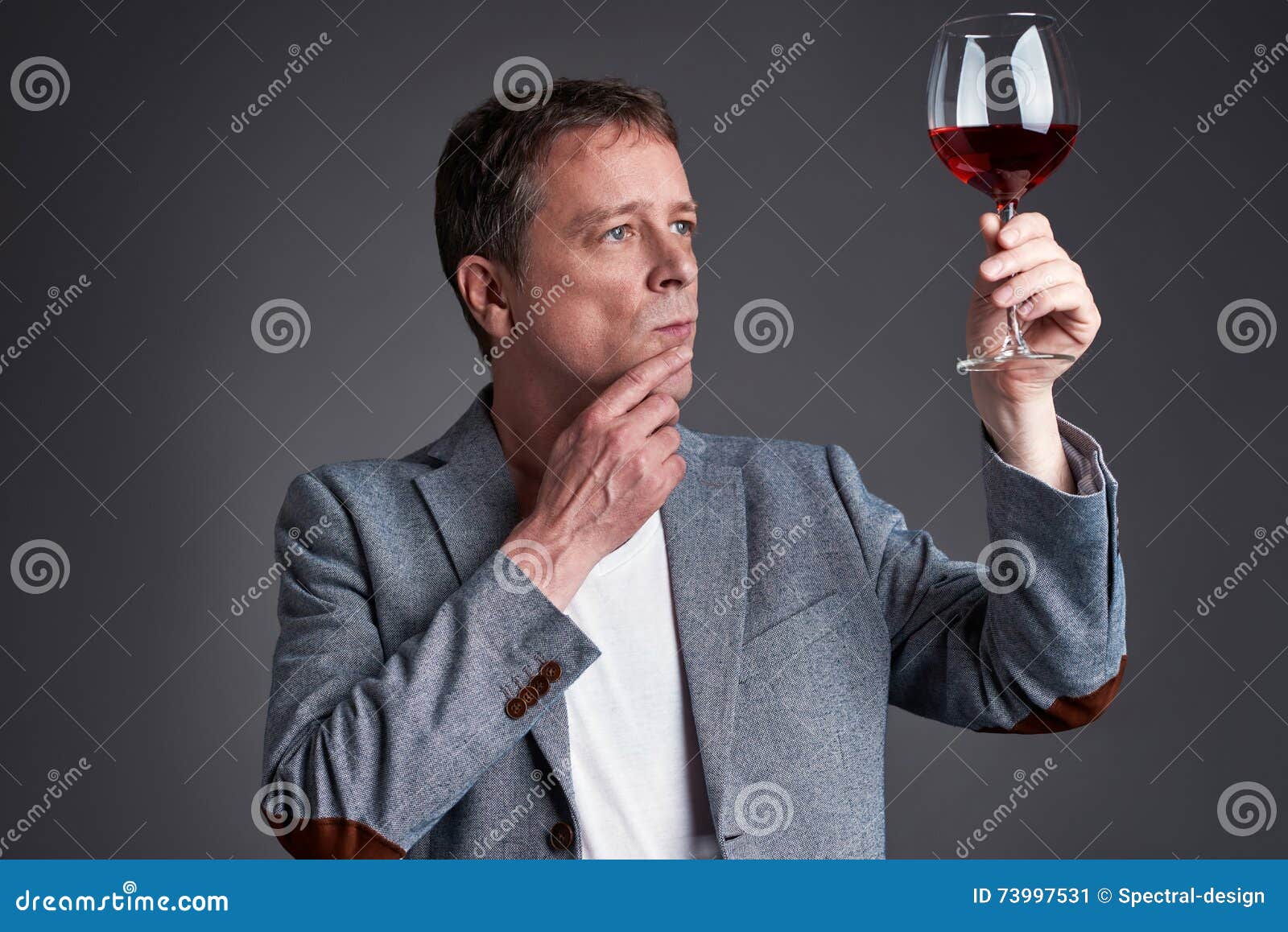 Man with glass of wine stock image. Image of elegant - 73997531