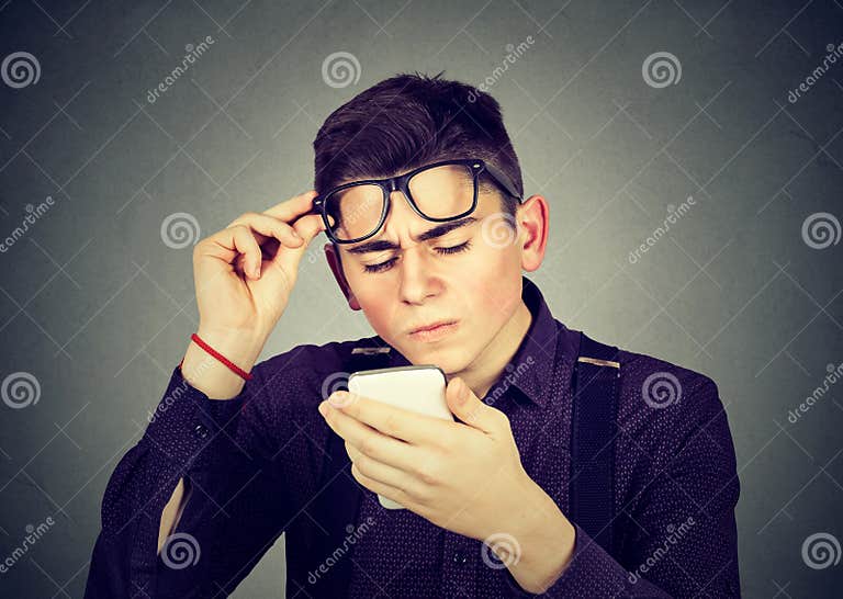 Man With Glasses Having Trouble Seeing Cell Phone Vision Problems Stock
