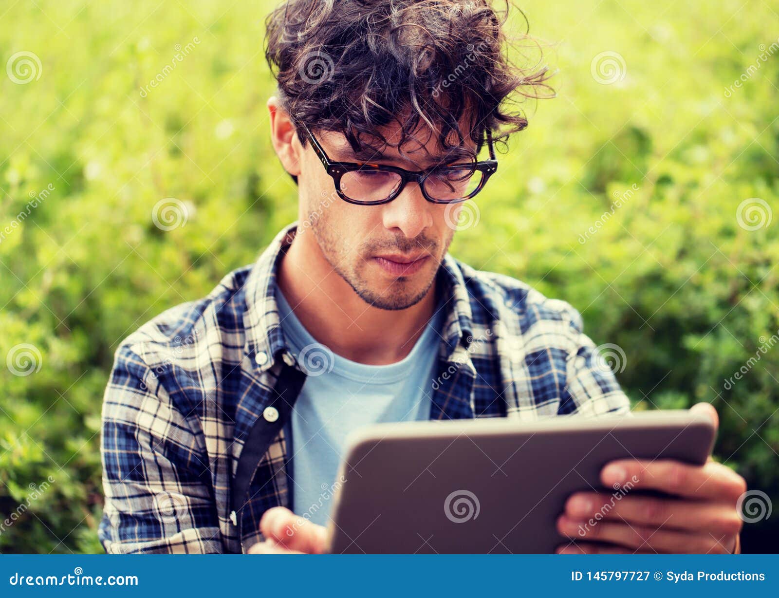 Man in Glasses with Tablet Pc Computer Outdoors Stock Image - Image of ...