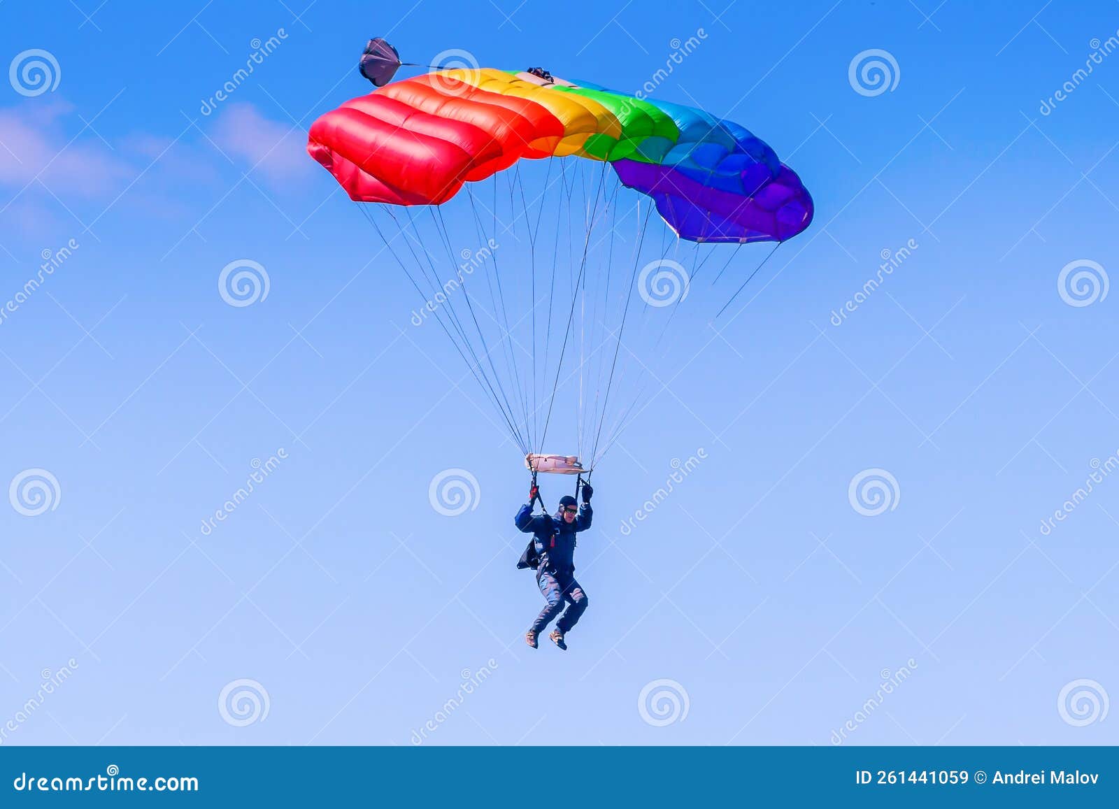 Man Gliding Down on a Parachute Stock Image - Image of danger, extreme ...