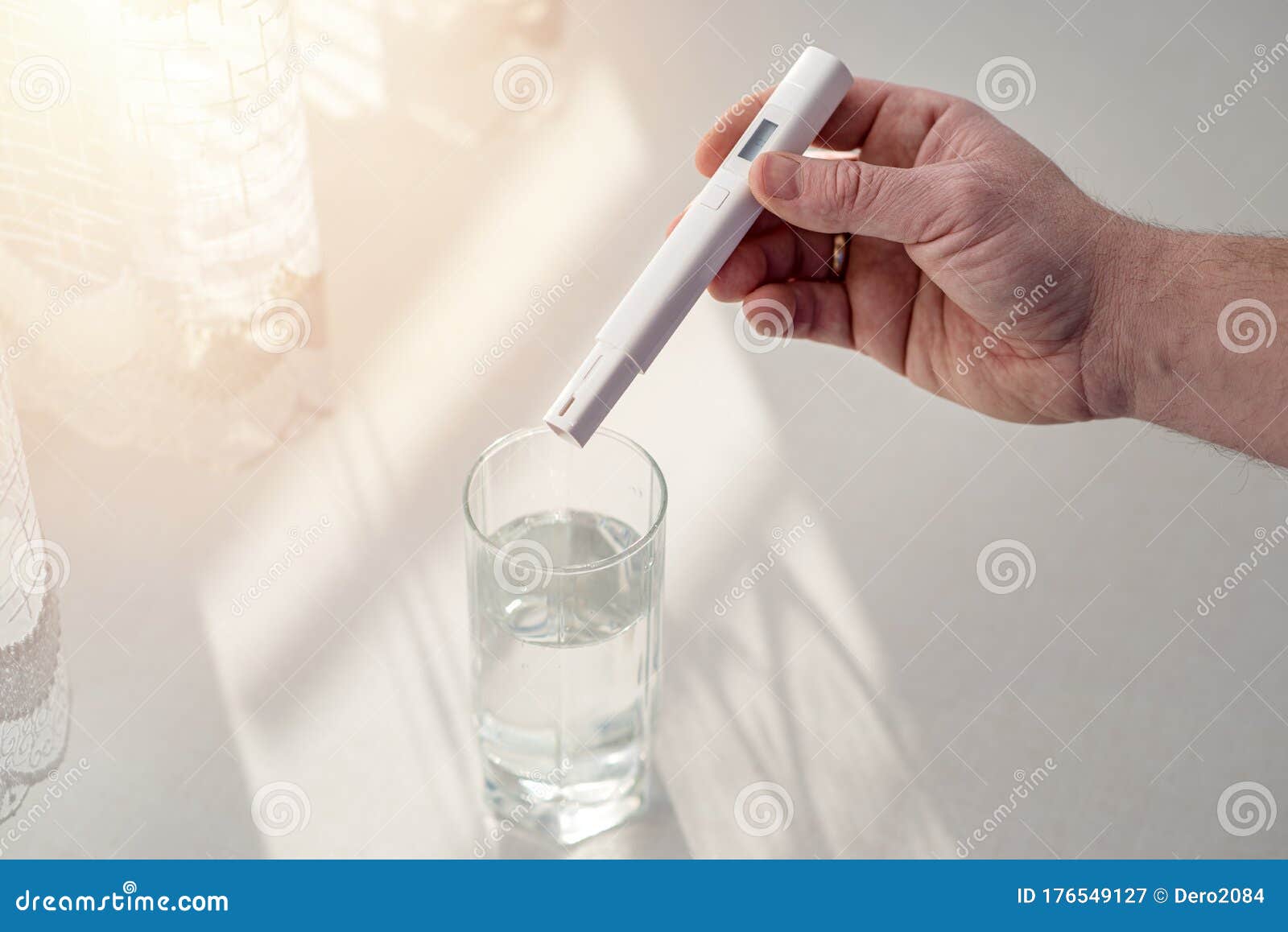 Man Going To Check Level of Water Purity Using a Portable Water TDS ...