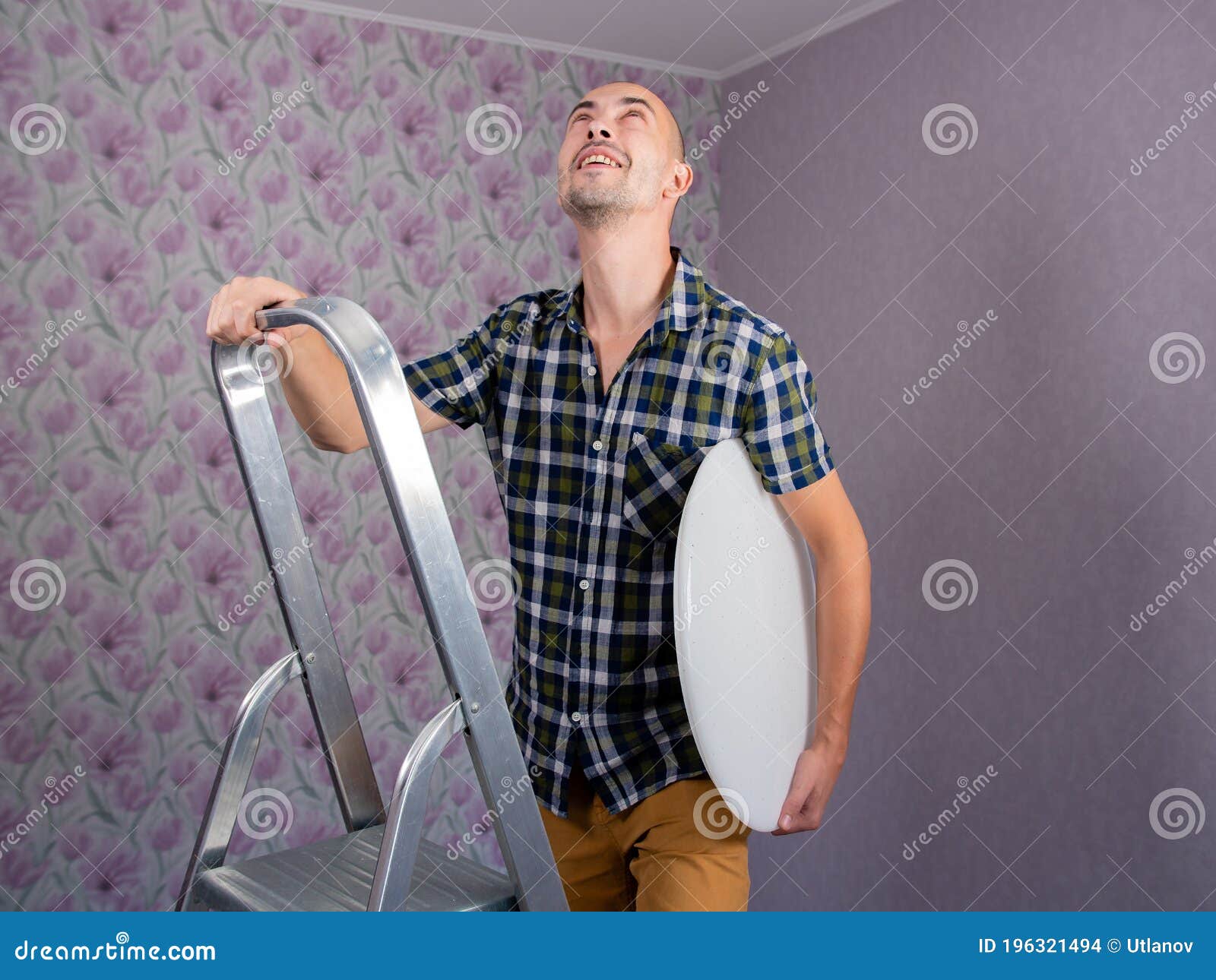 A Man is Going To Install an Led Ceiling Light. Stock Photo - Image of ...