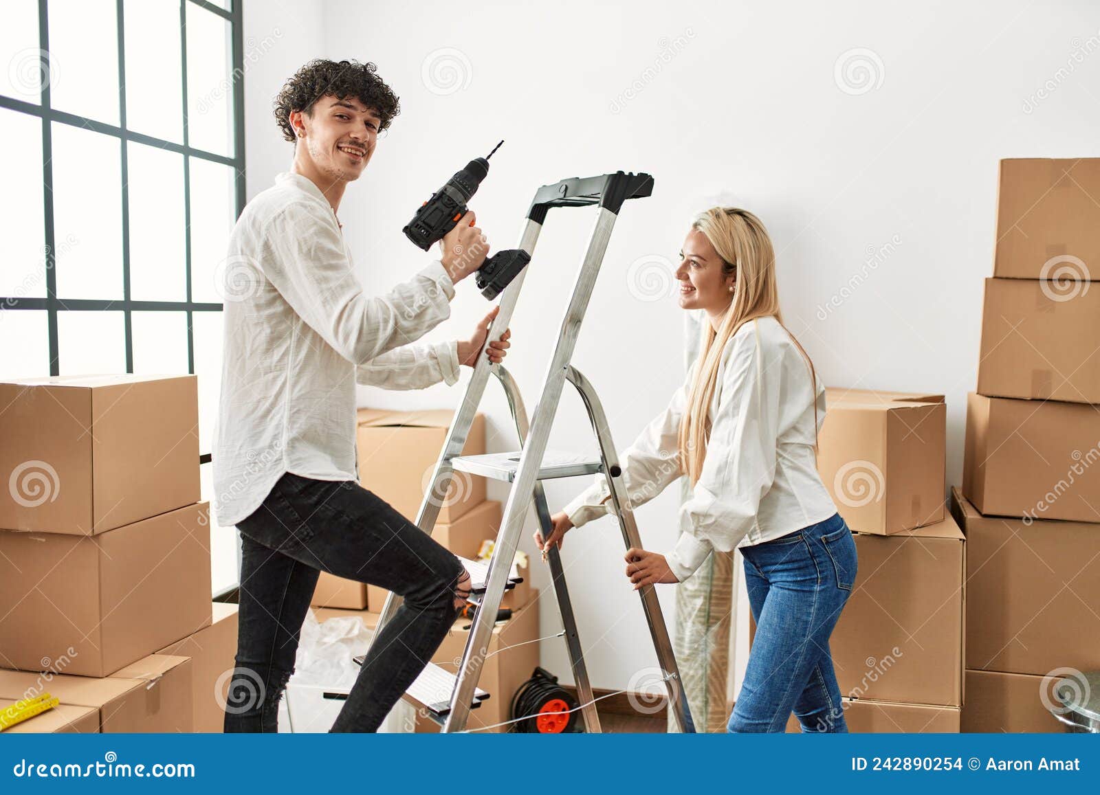 Man Going Up Ladder Holding Drill at New Home Stock Photo - Image of ...