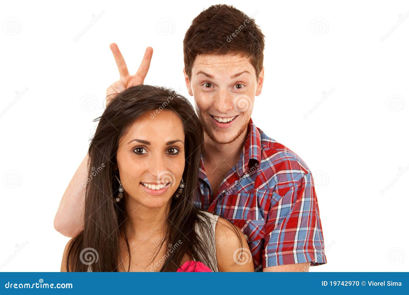 Man Goofing Around Behind His Girlfriend Stock Photo - Image of ...