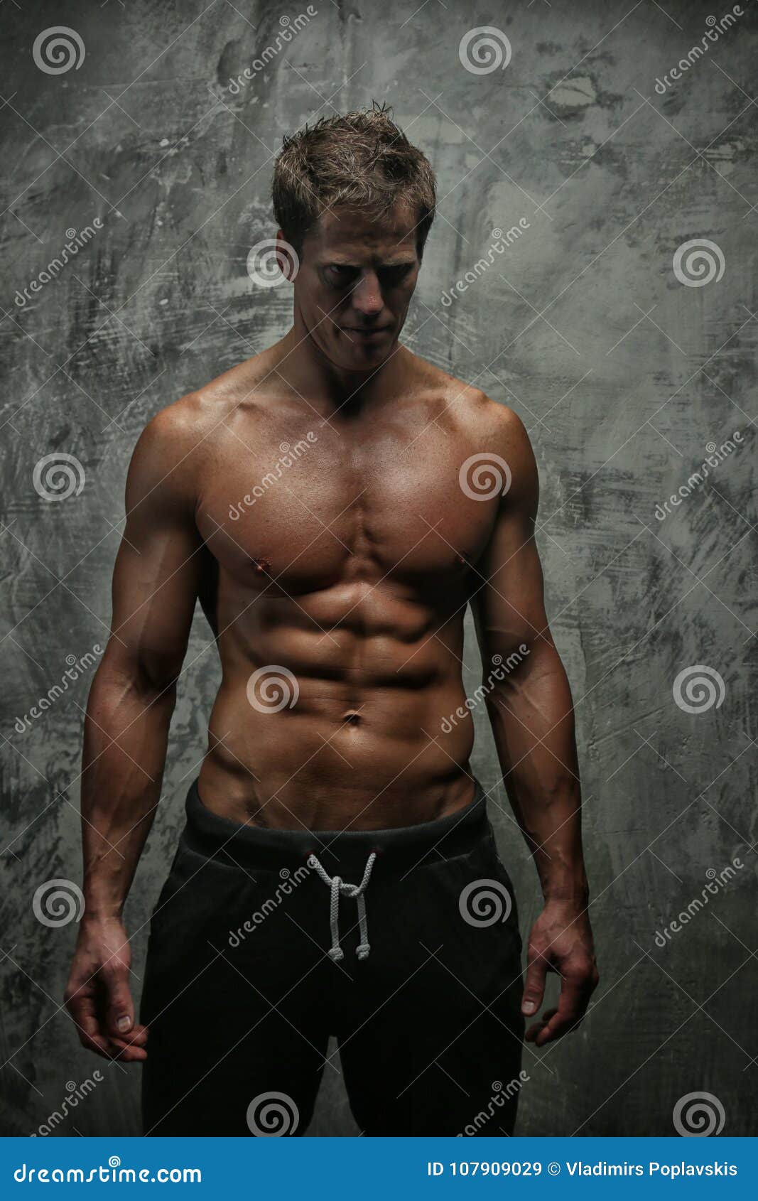 Muscular Man Posing in Studio Stock Image - Image of healthy, gray ...