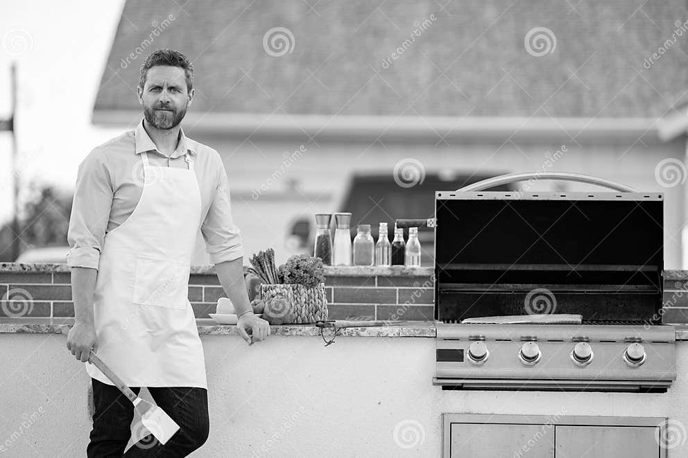 Man Grilling Salmon Fillet At Backyard Copy Space Photo Of Man Grilling Salmon Fillet For