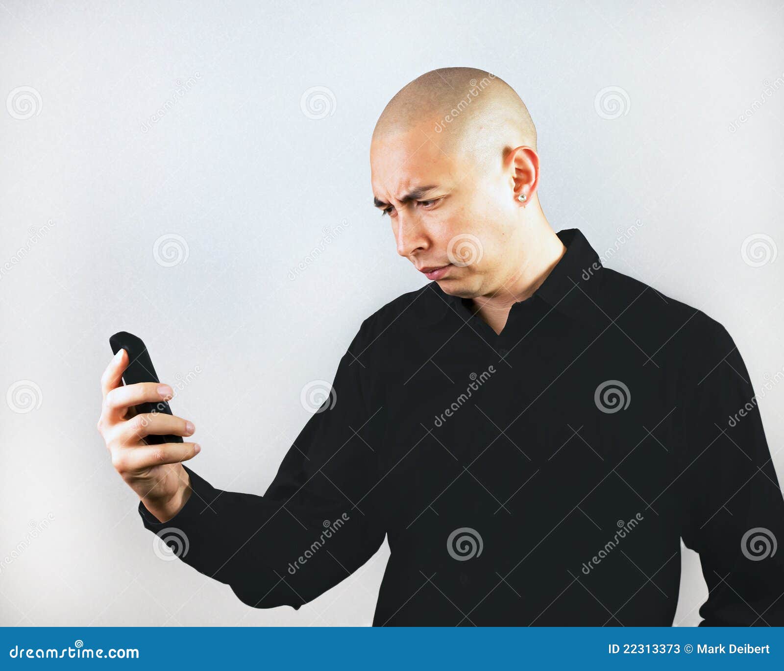 Man Grimacing at Smartphone Stock Image - Image of cellphone, mobile ...
