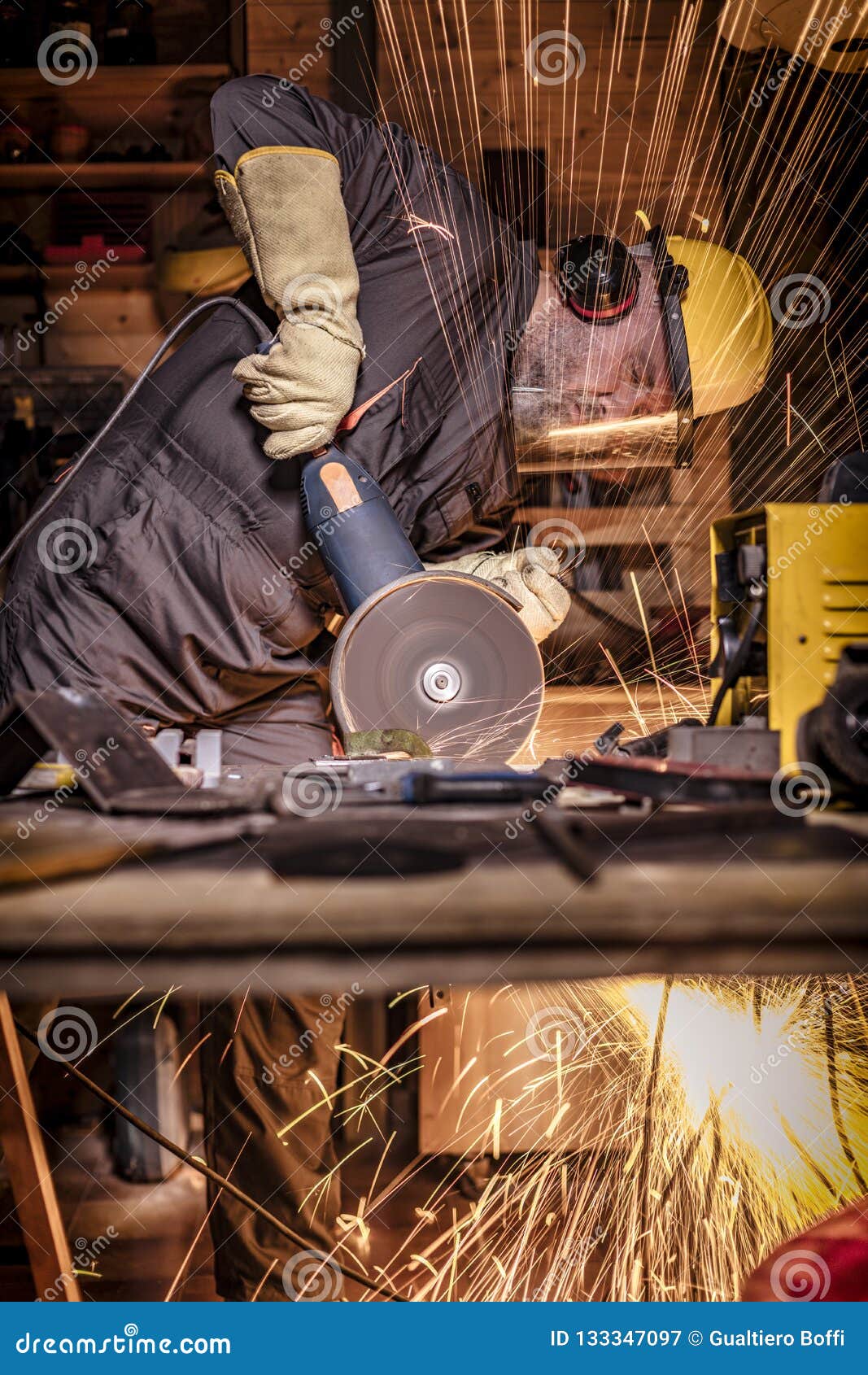 Man with grinder in action stock image. Image of spark - 133347097