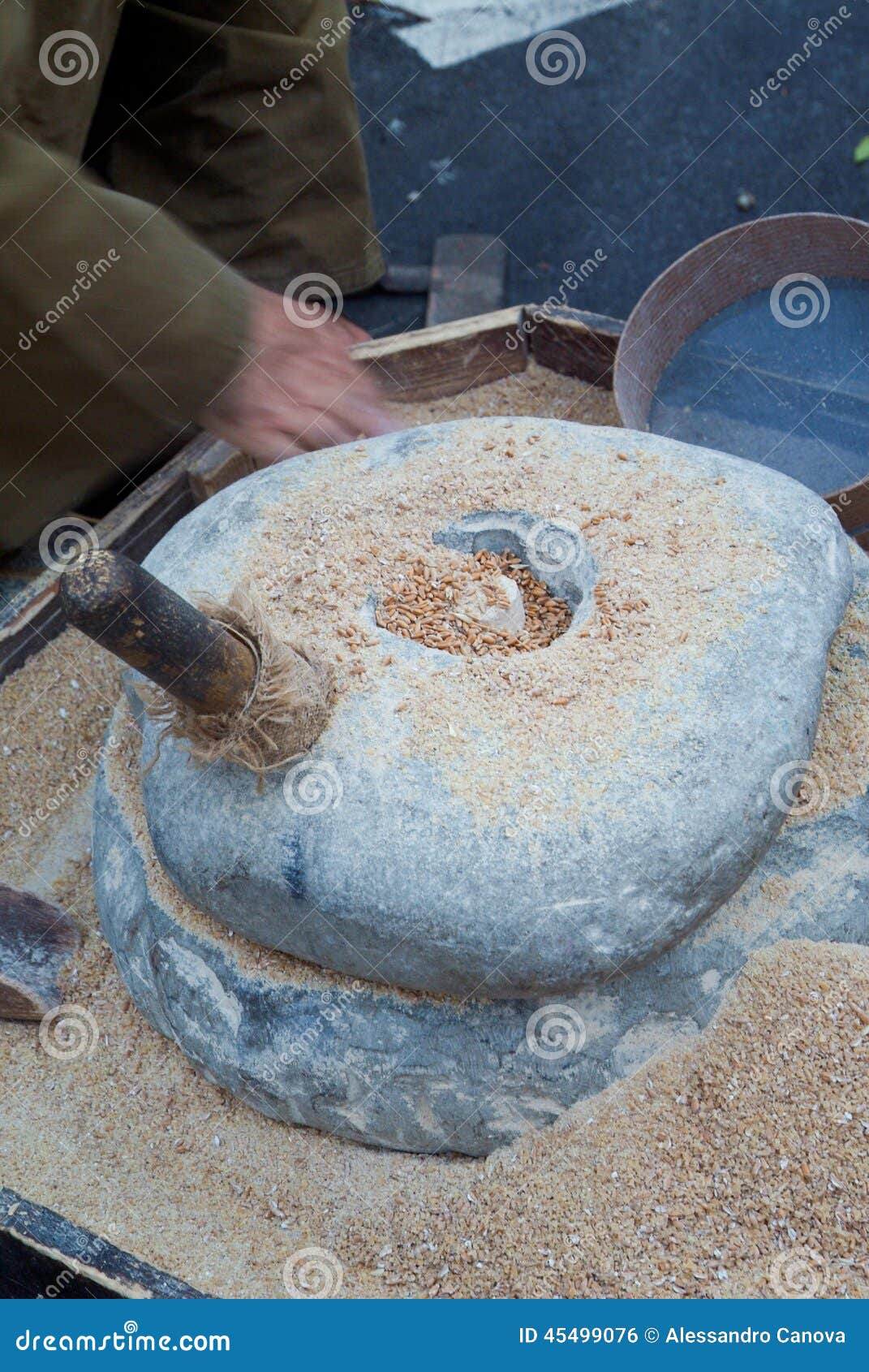 Man grinding grain stock photo. Image of grain, roman - 45499076