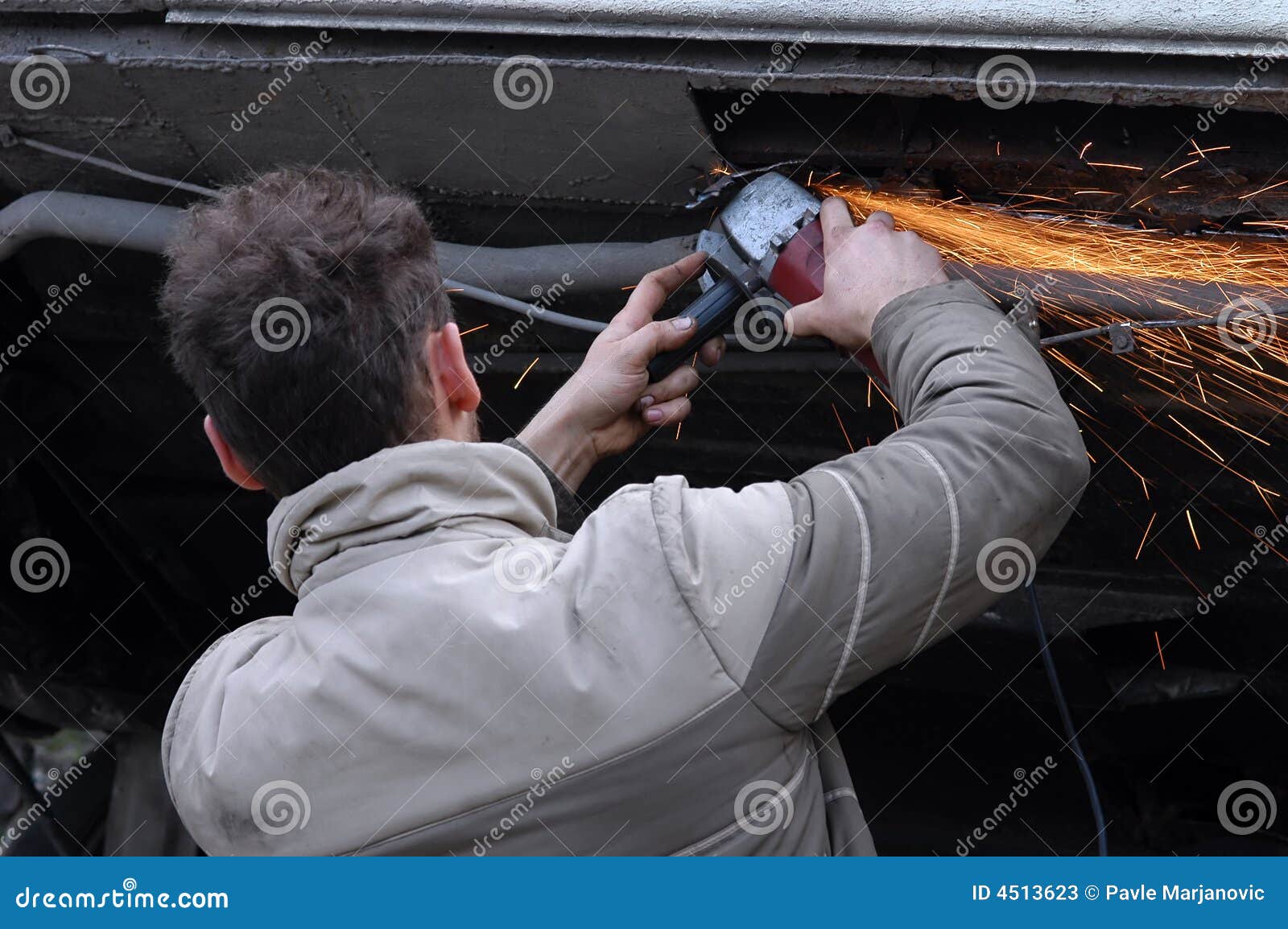 Man grinding his car stock image. Image of adult, clothing - 4513623