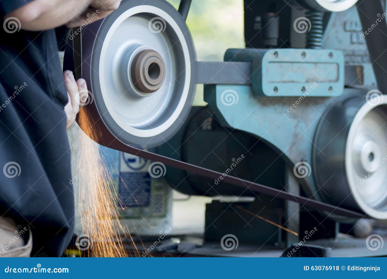 Man Grinding stock photo. Image of belt, sparks, grinder - 63076918