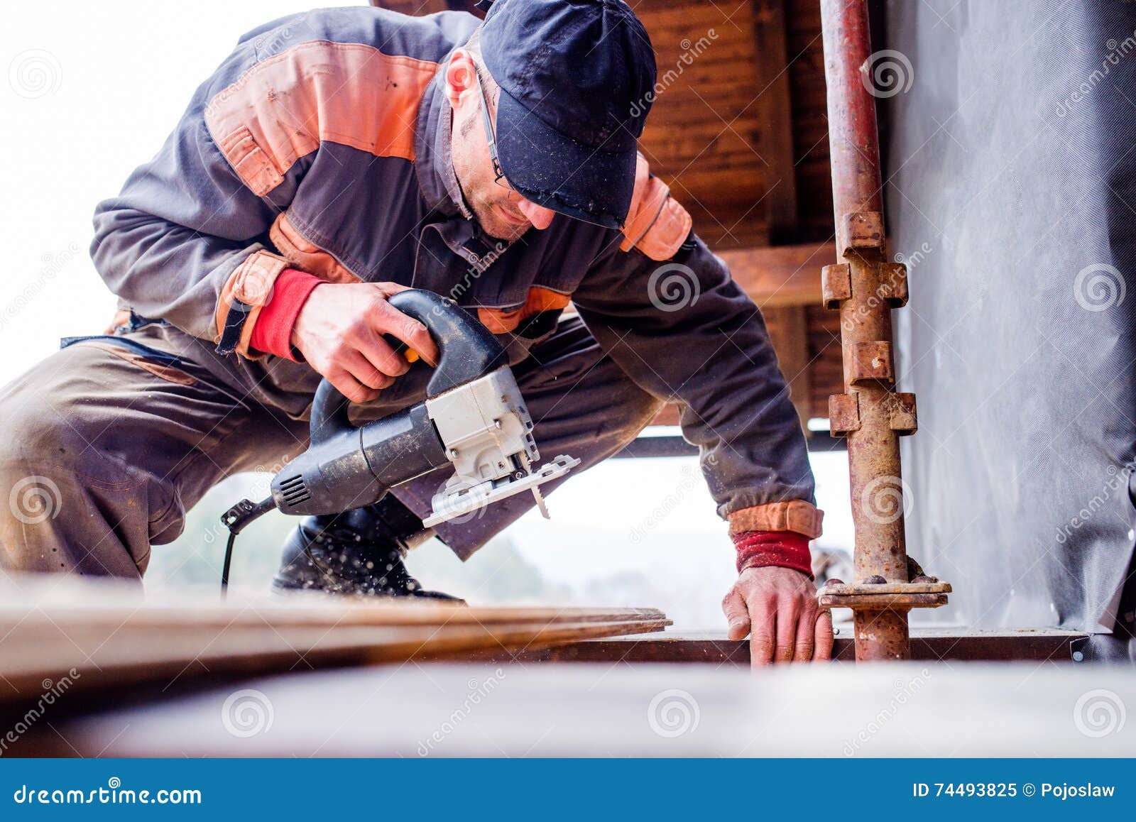 Man Grinding Planks of Wood for Home Construction. Stock Image - Image ...