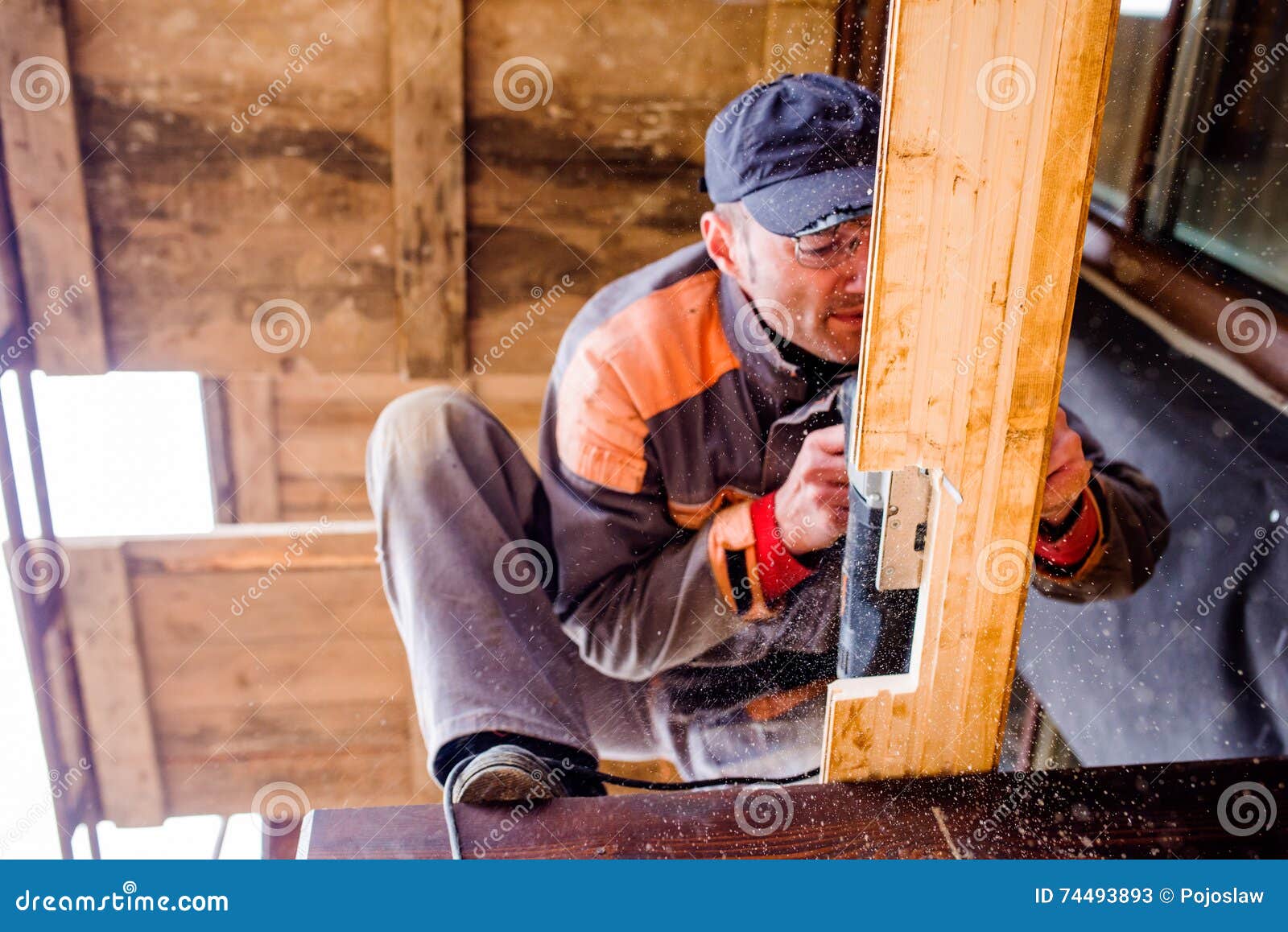 Man Grinding Planks of Wood for Home Construction. Stock Image - Image ...