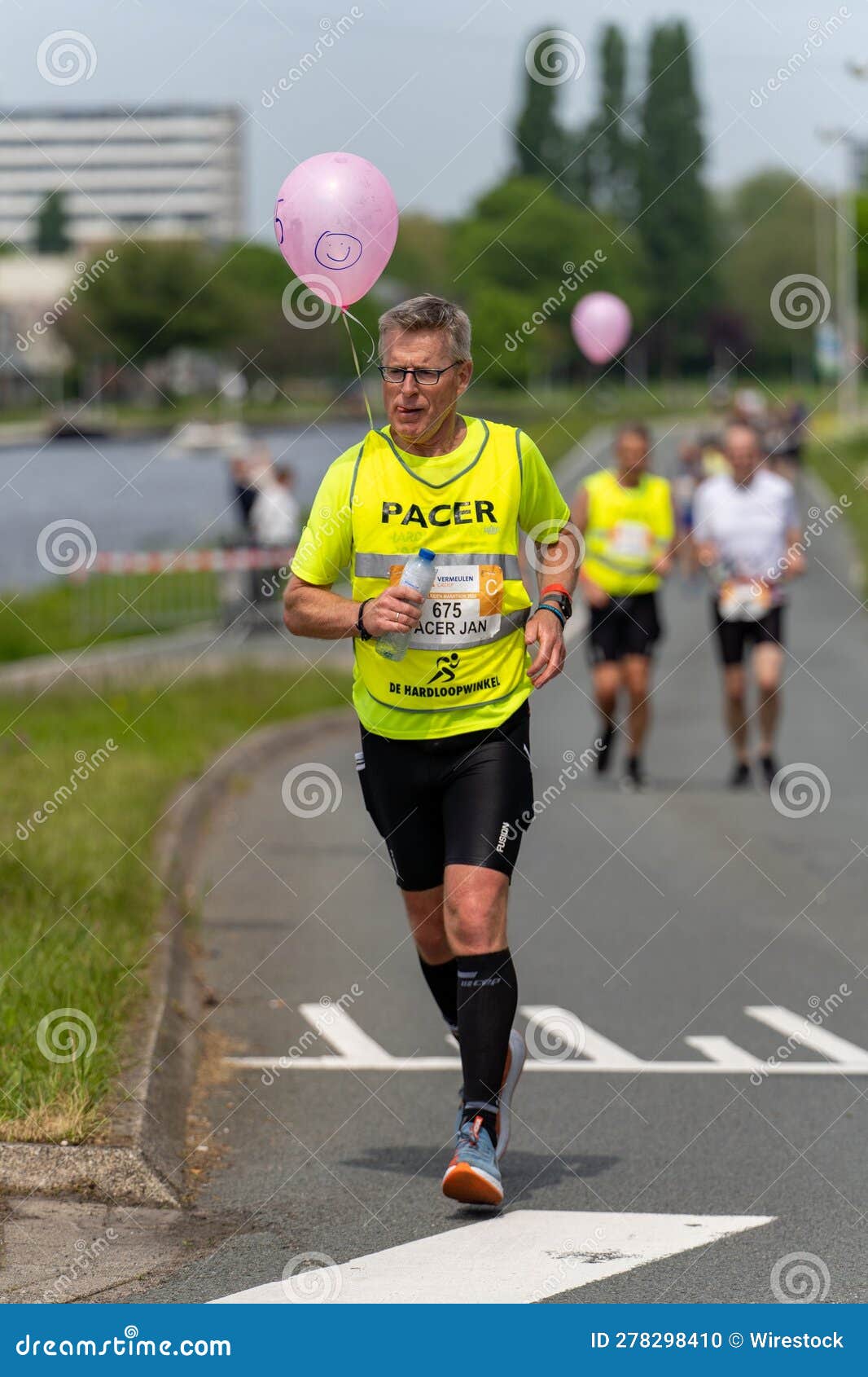 Man with a Group of People Running in a Marathon Editorial Image ...