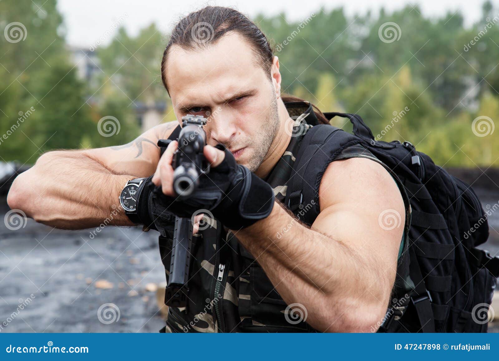 Man with a gun stock photo. Image of automatic, combat - 47247898