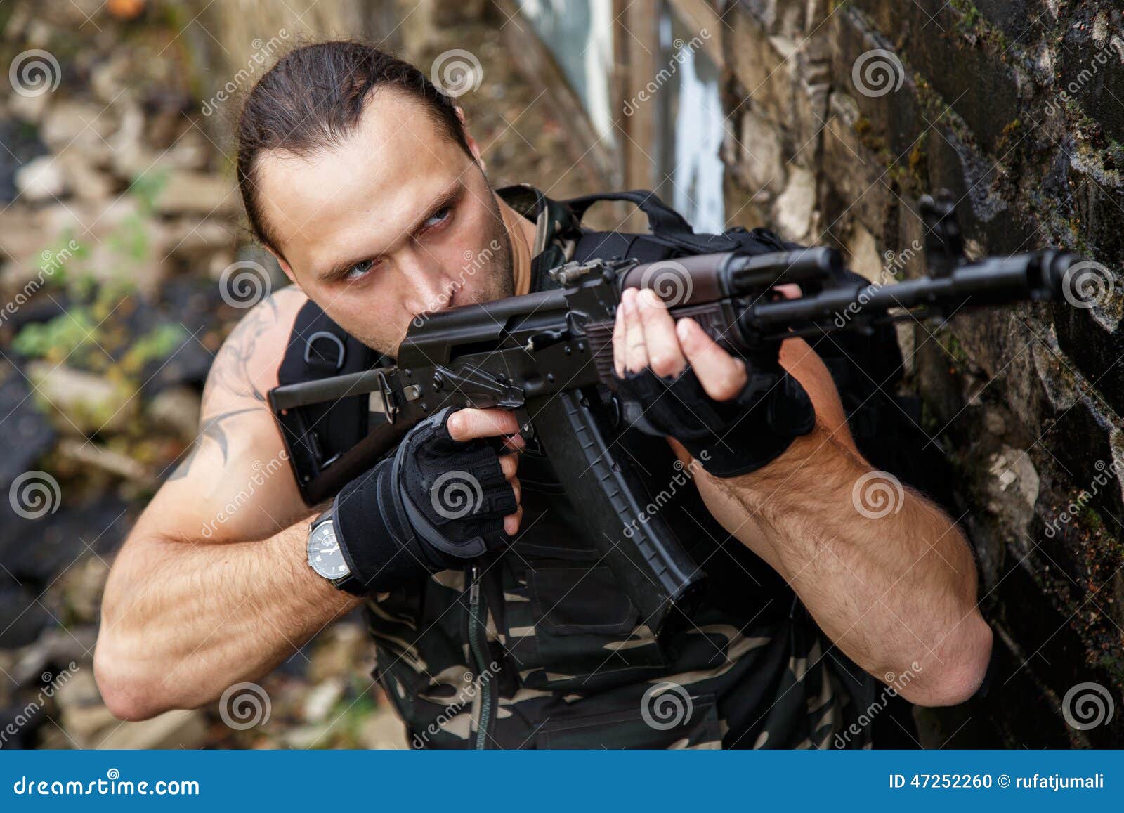 Man with a gun stock photo. Image of resistance, dress - 47252260