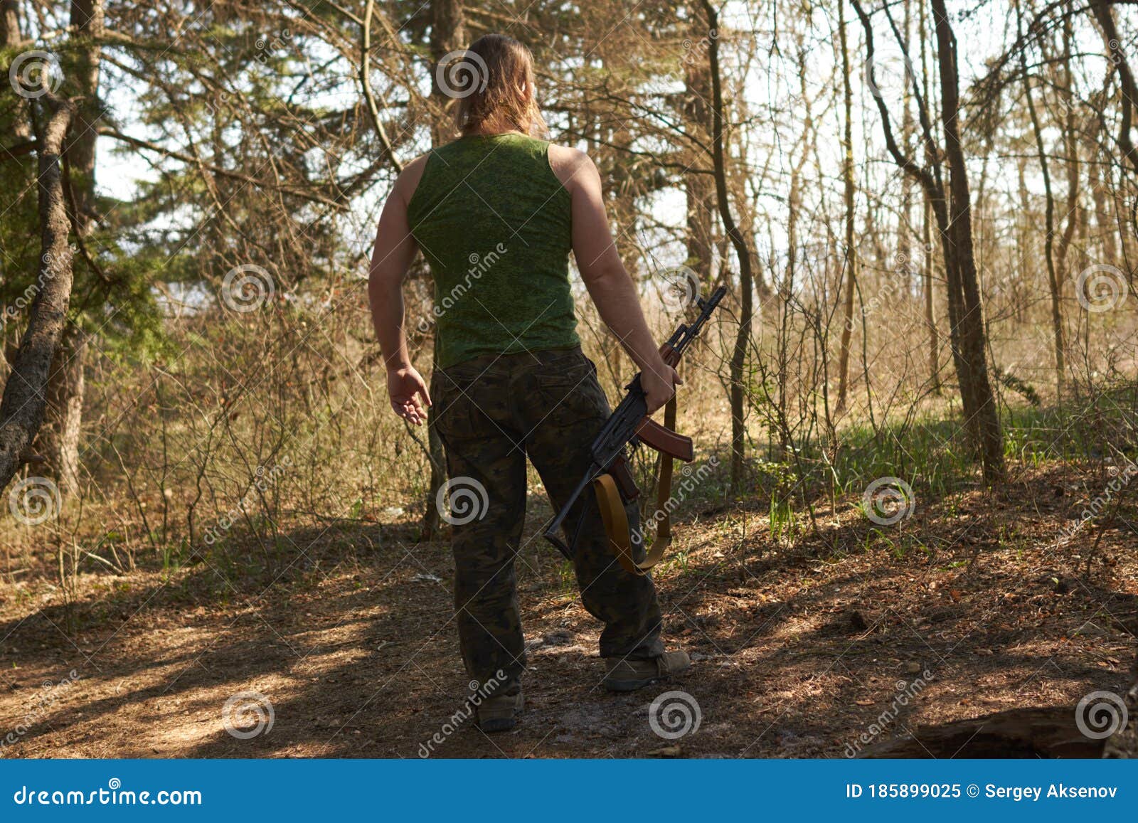 A Man with a Gun in a Forest Stock Image - Image of shoot, male: 185899025