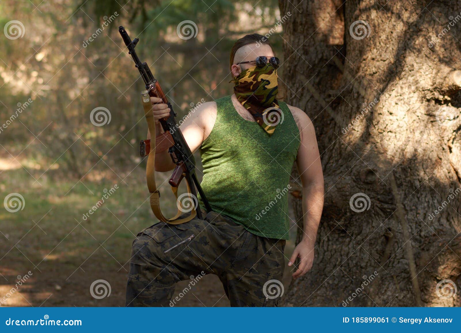 A Man with a Gun in a Forest Stock Image - Image of sunlight, soldier ...
