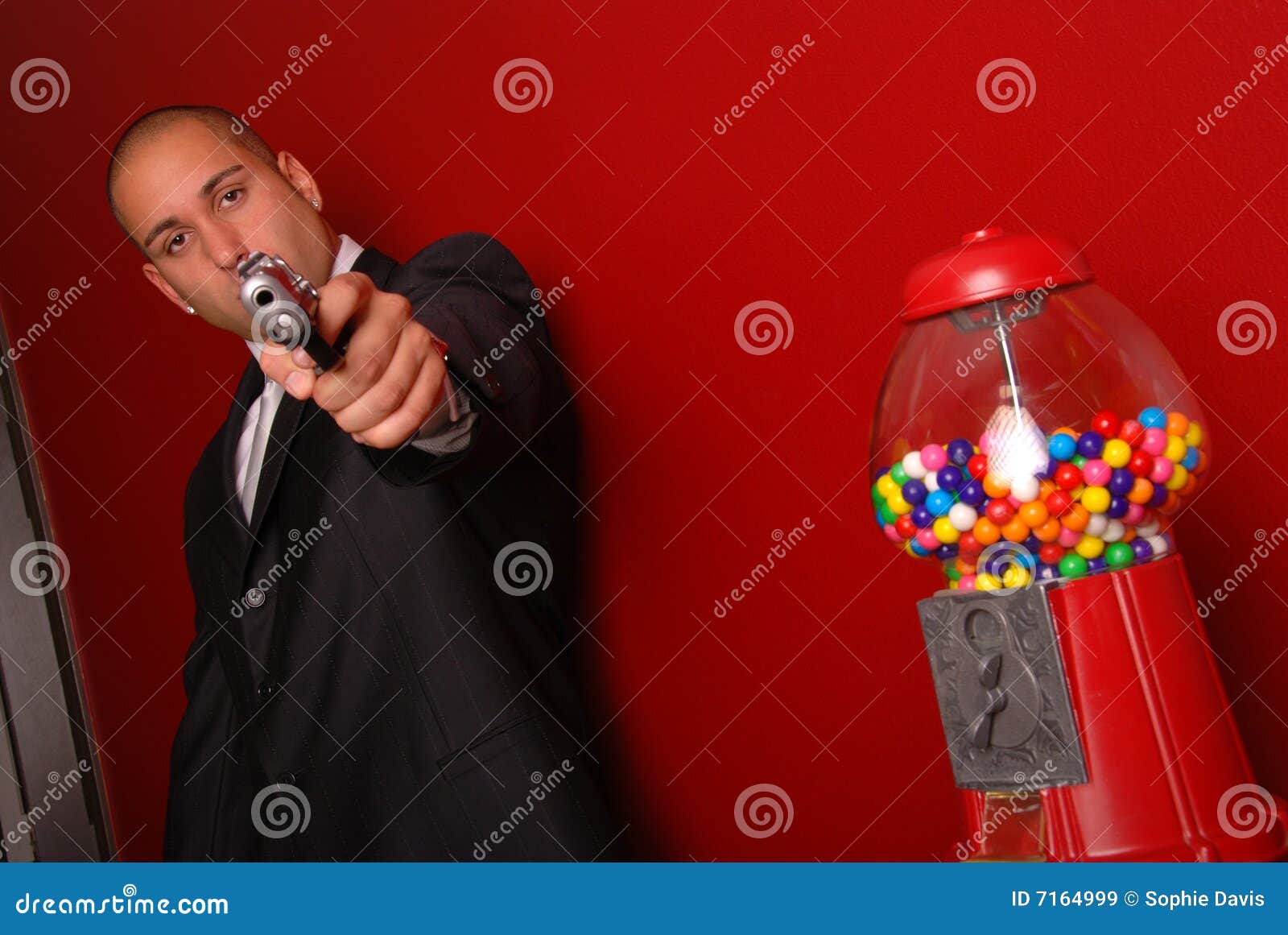 Man, Gun and Gumball Machine. Stock Image - Image of head, adult: 7164999