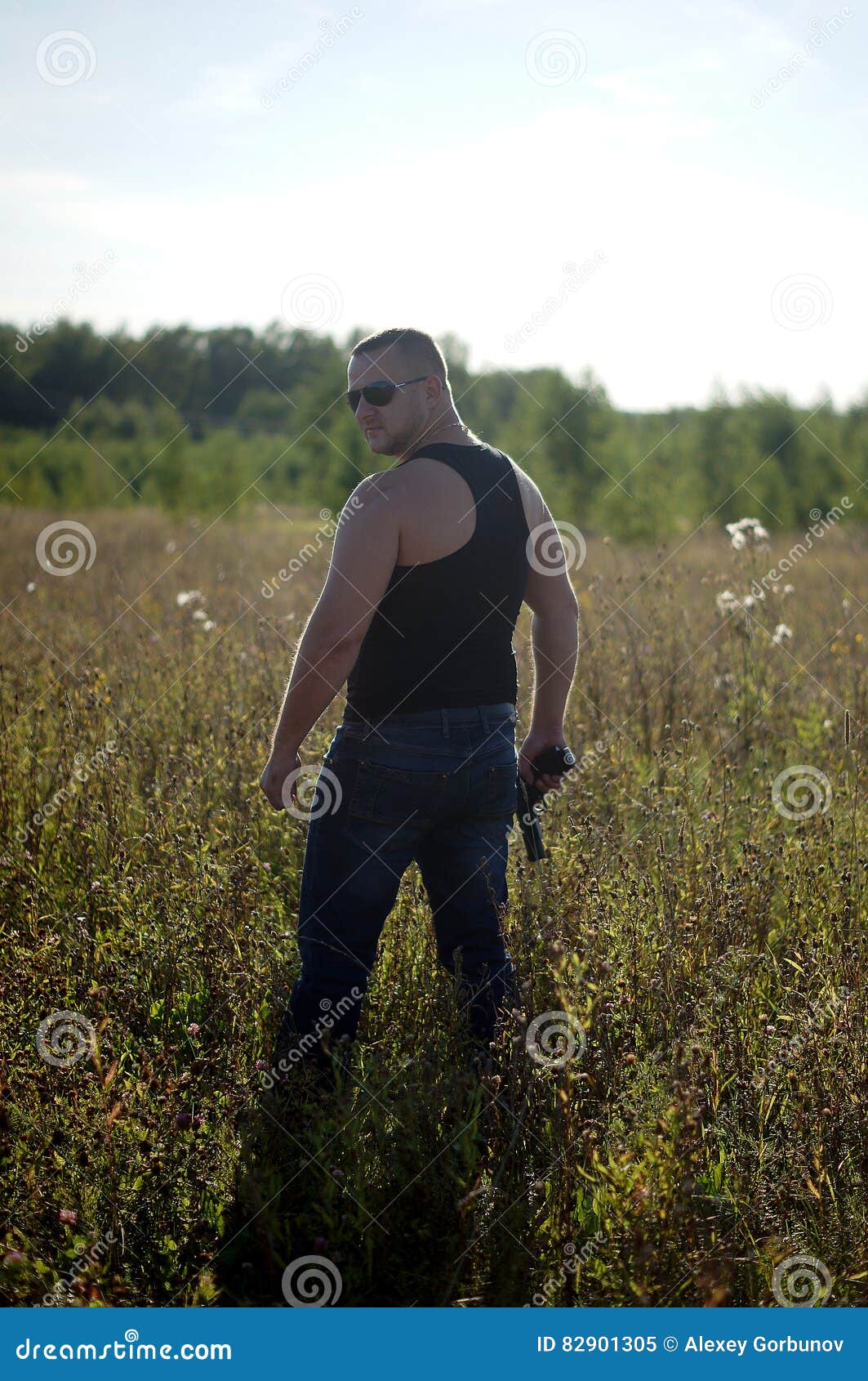 A Man with a Gun in His Hands.Back View Stock Image - Image of skill ...