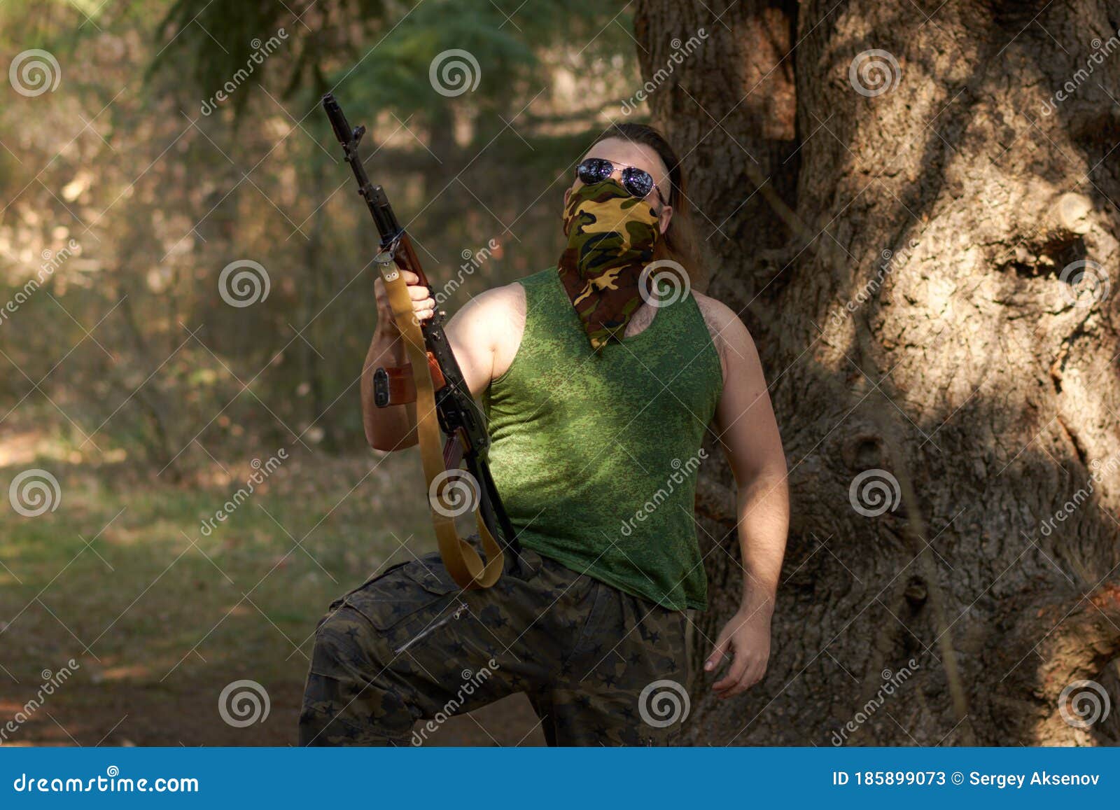 A Man with a Gun in a Forest Stock Image - Image of grizzly, charge ...
