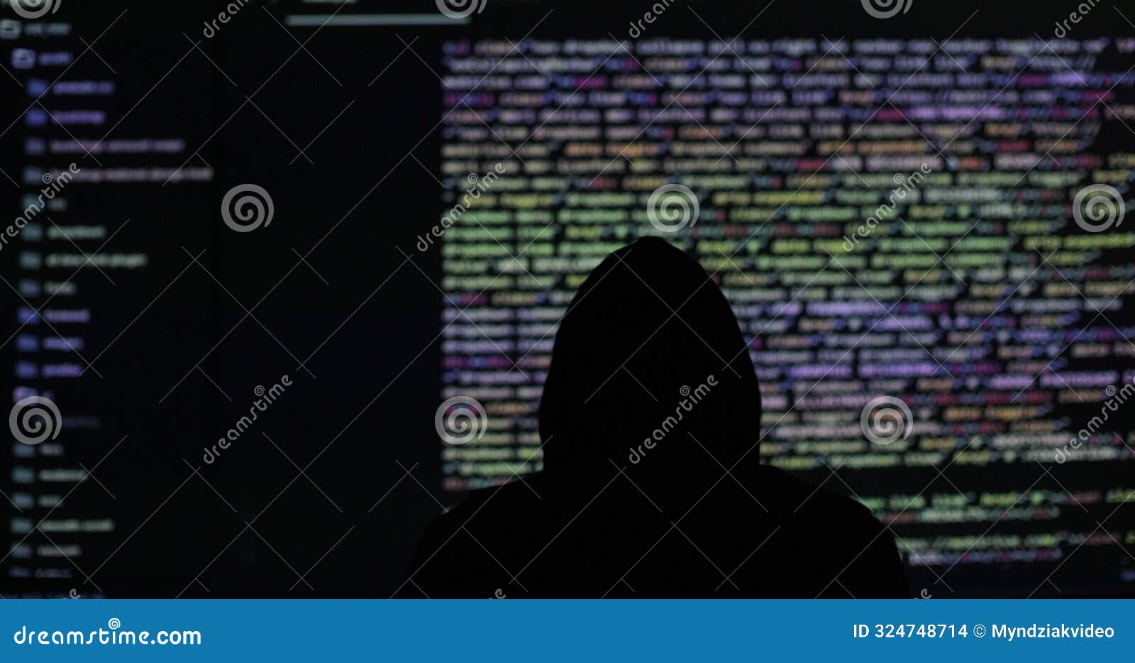 Man Hacker Working in Dark Abstract Room. Programming Code on a Large Screen in the Background ...