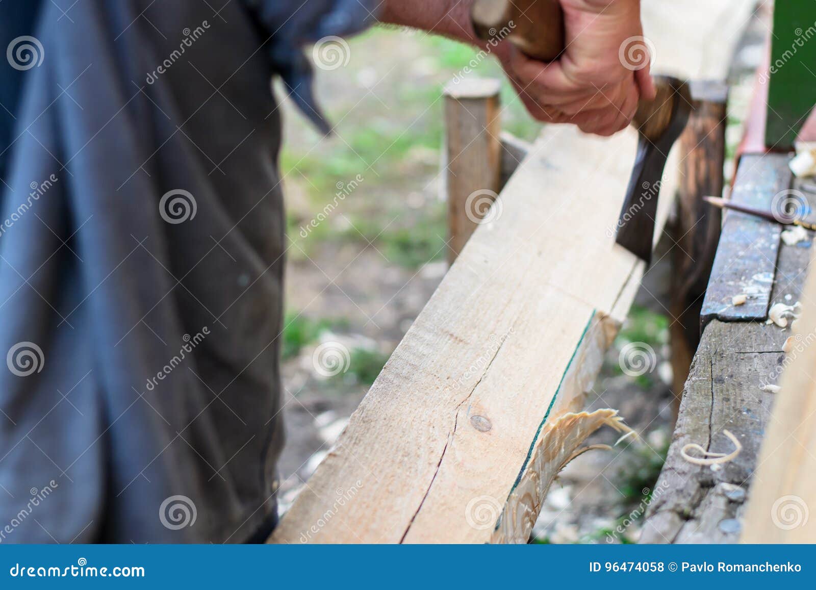 A Man Hacking a Wooden Board with an Ax Stock Photo - Image of crafts ...