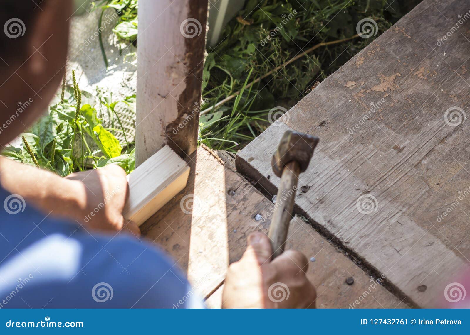 Man Hammering a Nail in the Floor Stock Image - Image of caucasian ...