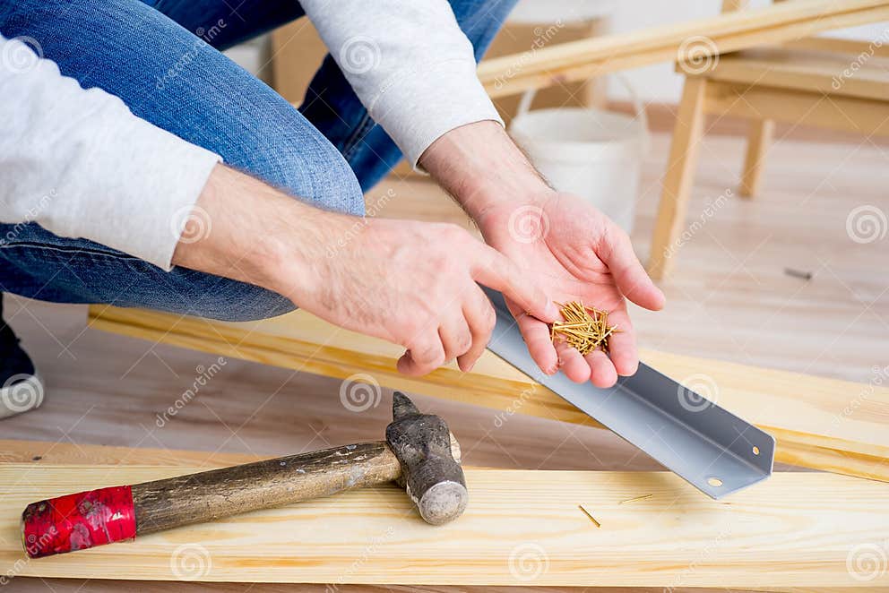 Man hammering nails stock image. Image of confident, hammer - 91403101