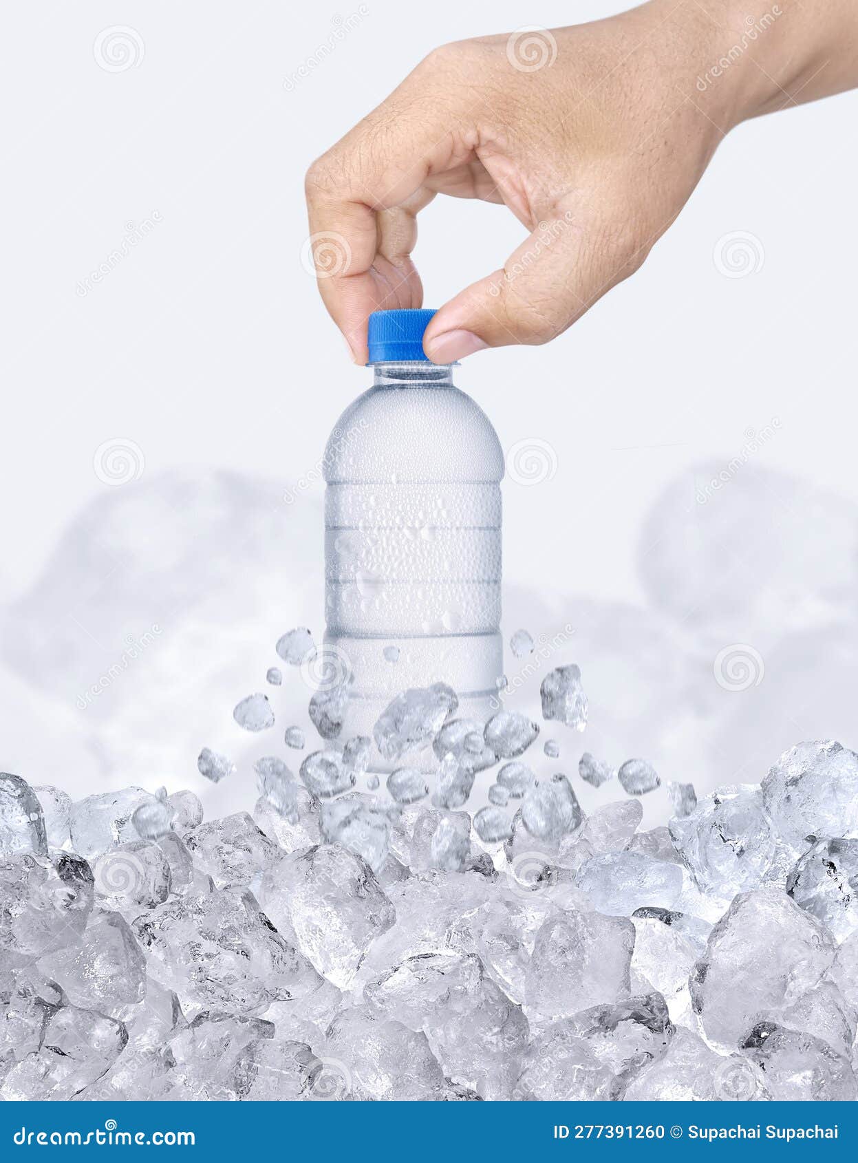 A Man Hand with Bottle of Water Passing through Ice Cubes Stock Photo ...
