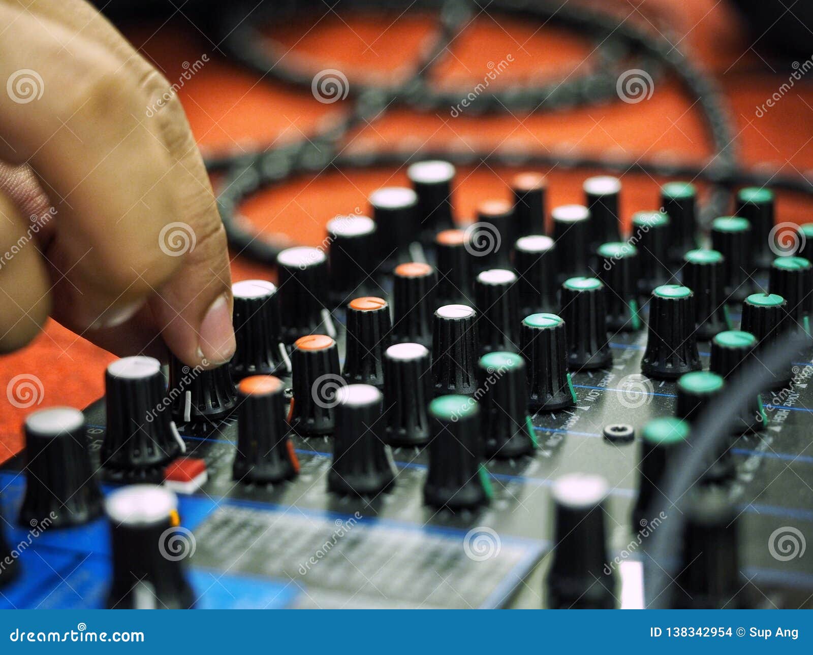 Close Up Man Hand Turning Button of Sound Control Equipment. Stock ...