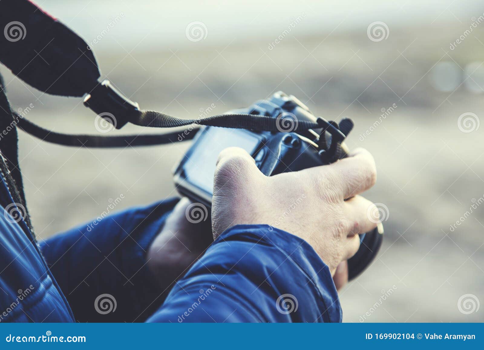 Man hand camera in nature stock photo. Image of people - 169902104