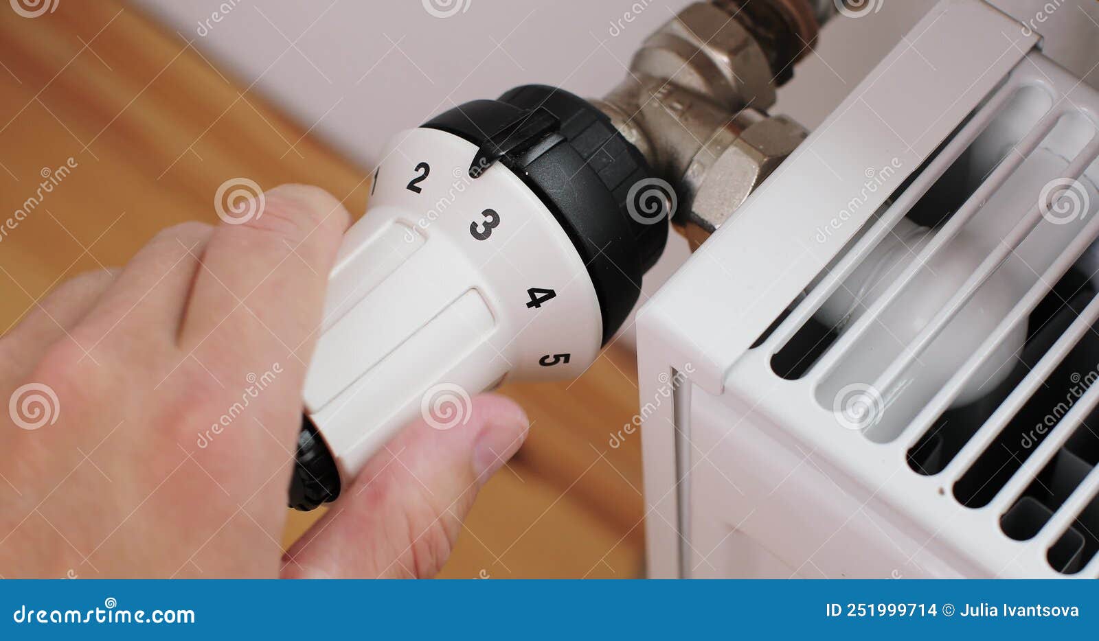 Man Hand Changing the Temperature on the Radiator by Temperature ...
