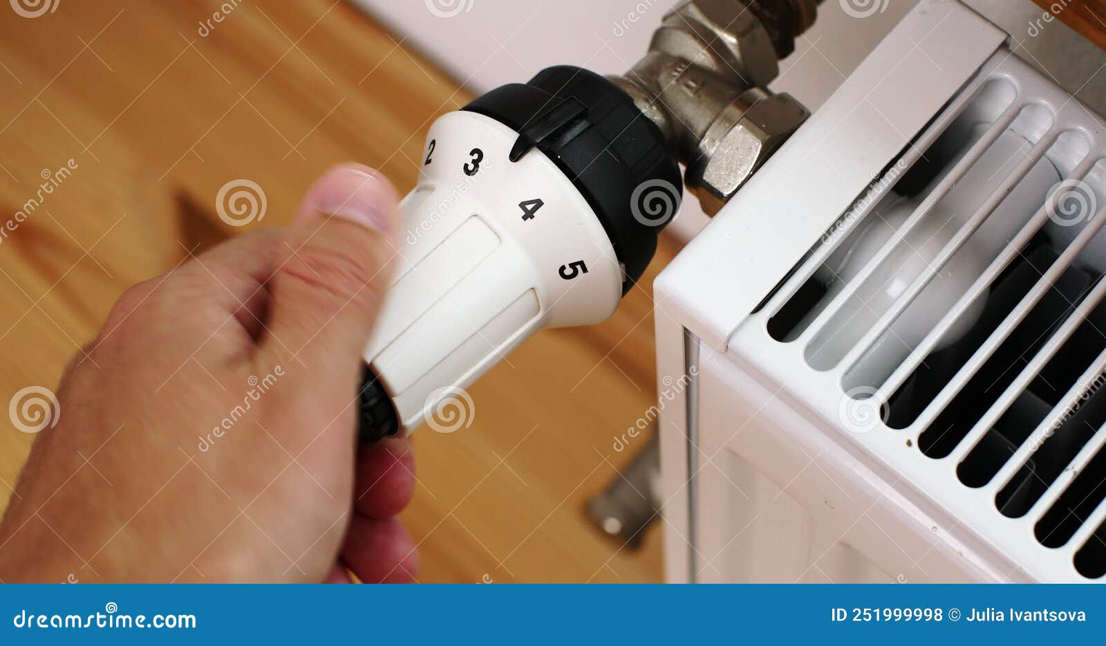 Man Hand Changing the Temperature on the Radiator by Temperature ...