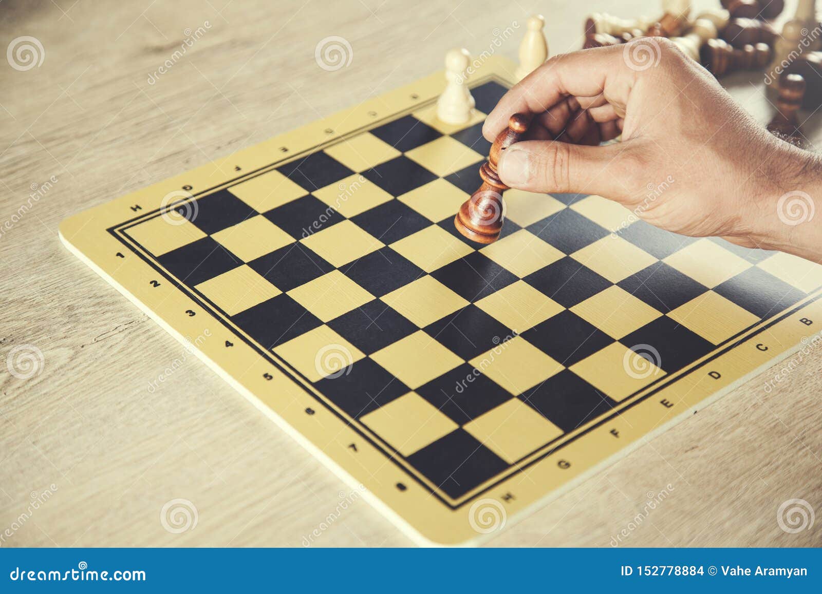 Man hand chess on board stock photo. Image of planning - 152778884
